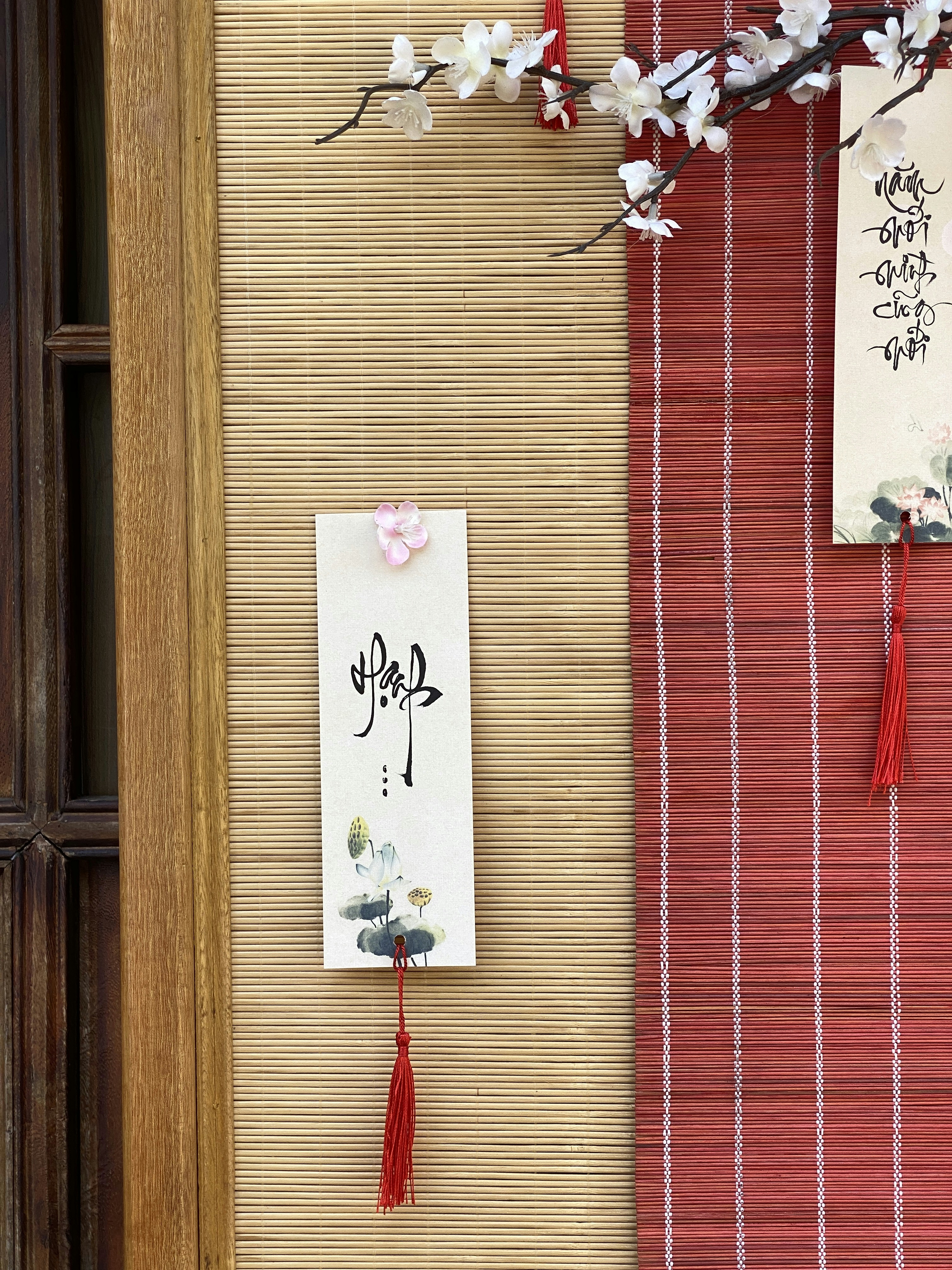 Vertical Scroll: A Minimal Chinese Pendant on a Textured Wall