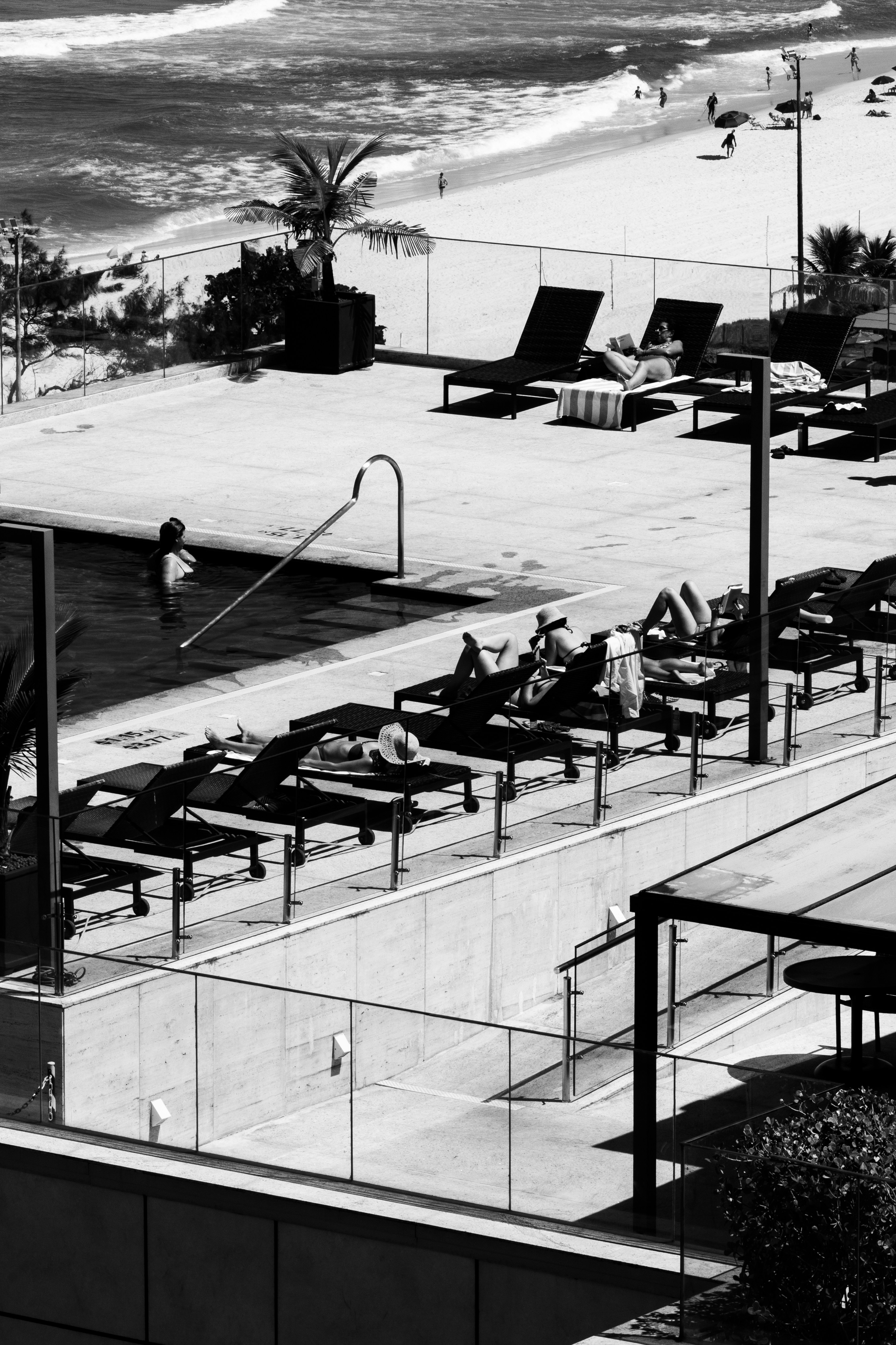 Terrace by the Tides: Sunloungers, Shadows, and Sea