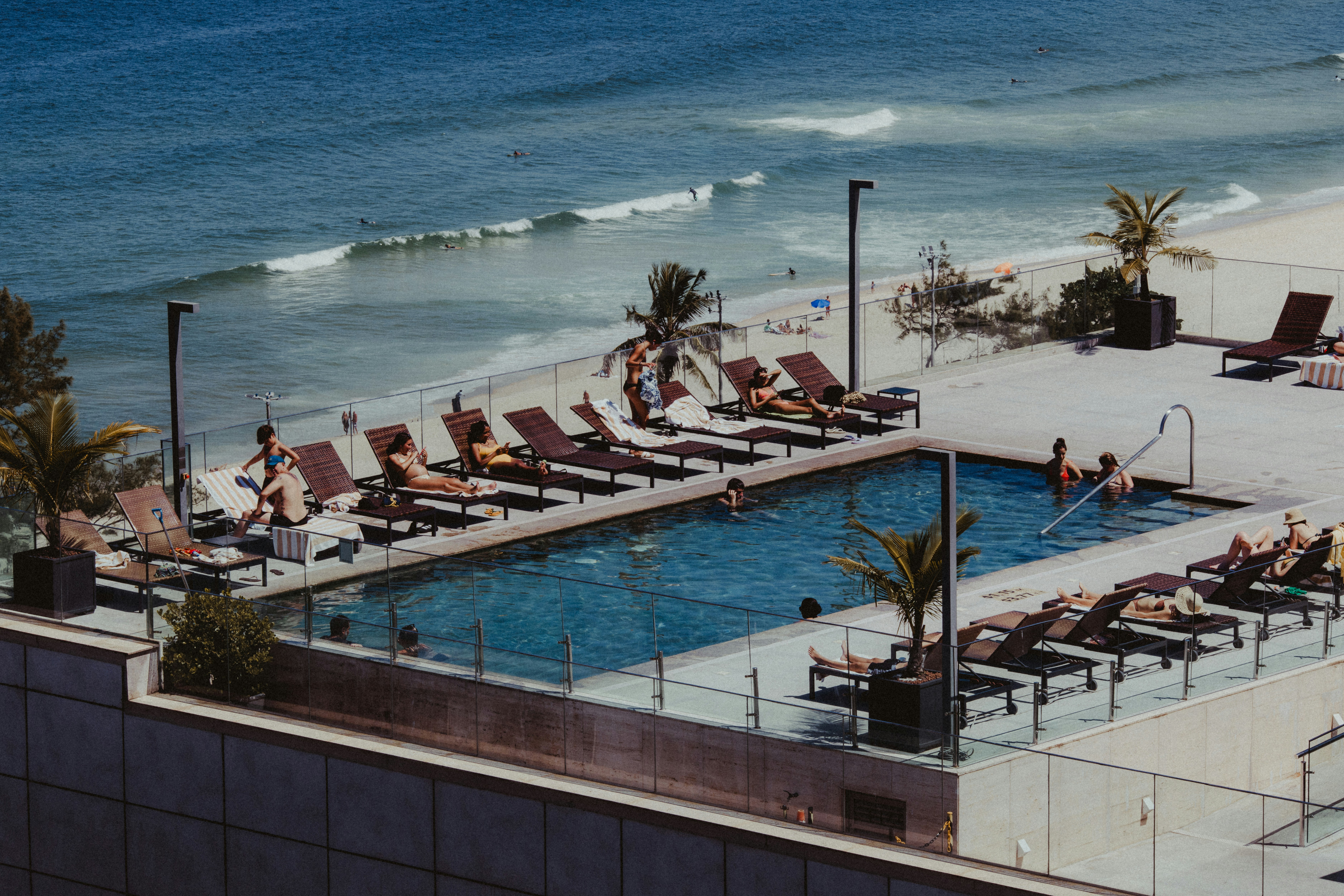 Rooftop Oasis: Sunloungers, Pool, and Ocean Breeze