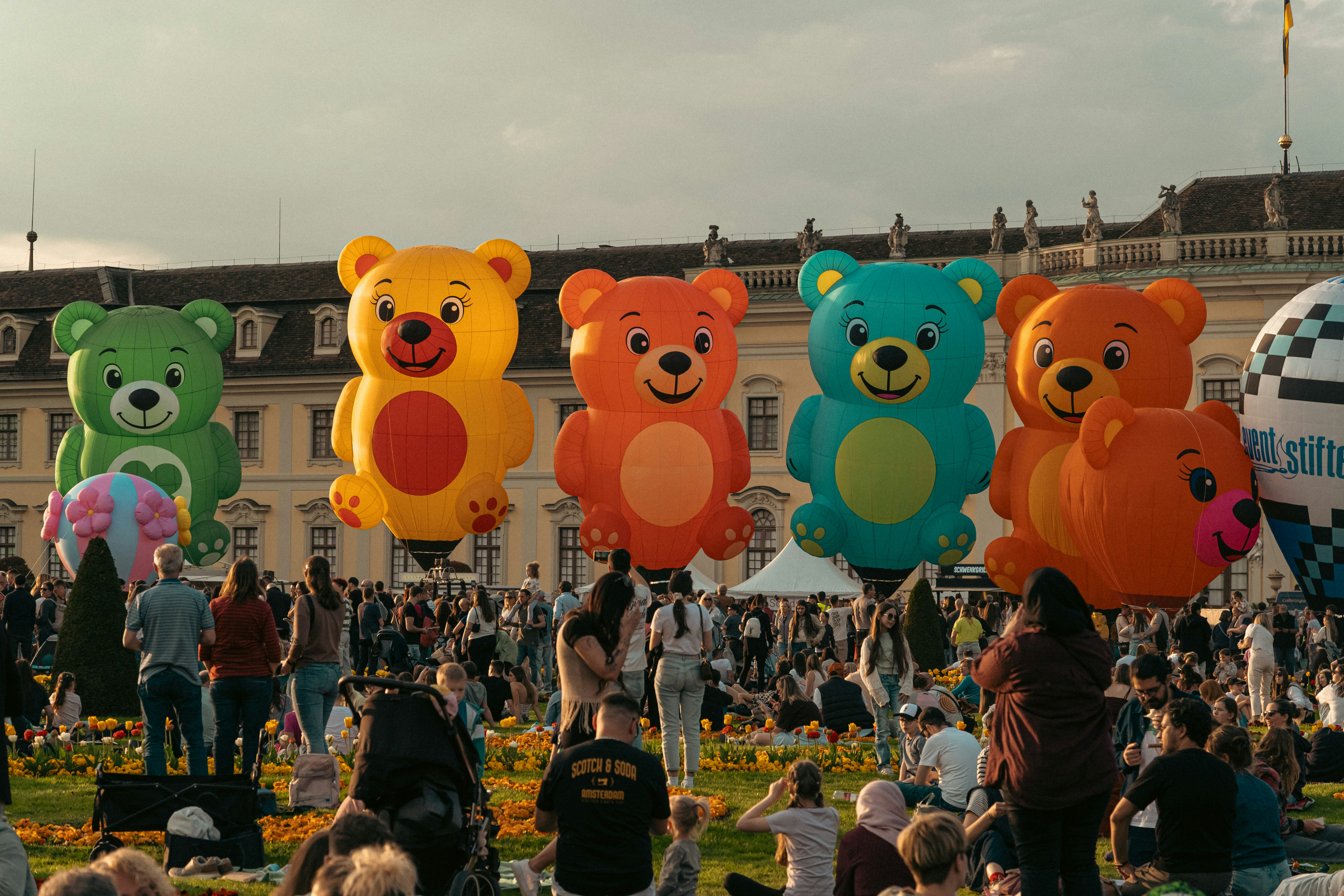 Giant Balloon Bears Loom Over a Crowded Festival Lawn