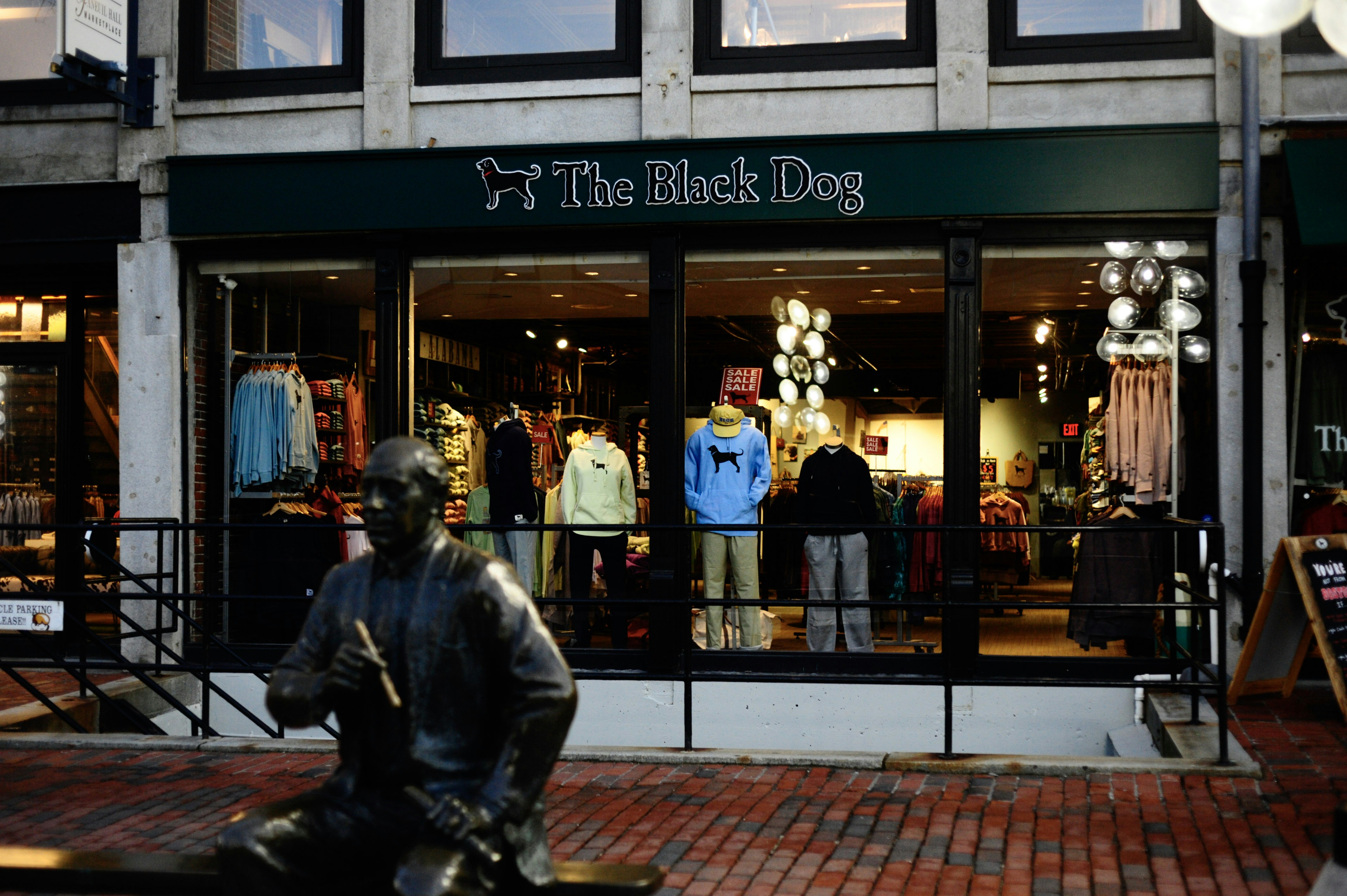 Shopfront Spotlight: The Black Dog storefront with a bronze statue in the foreground