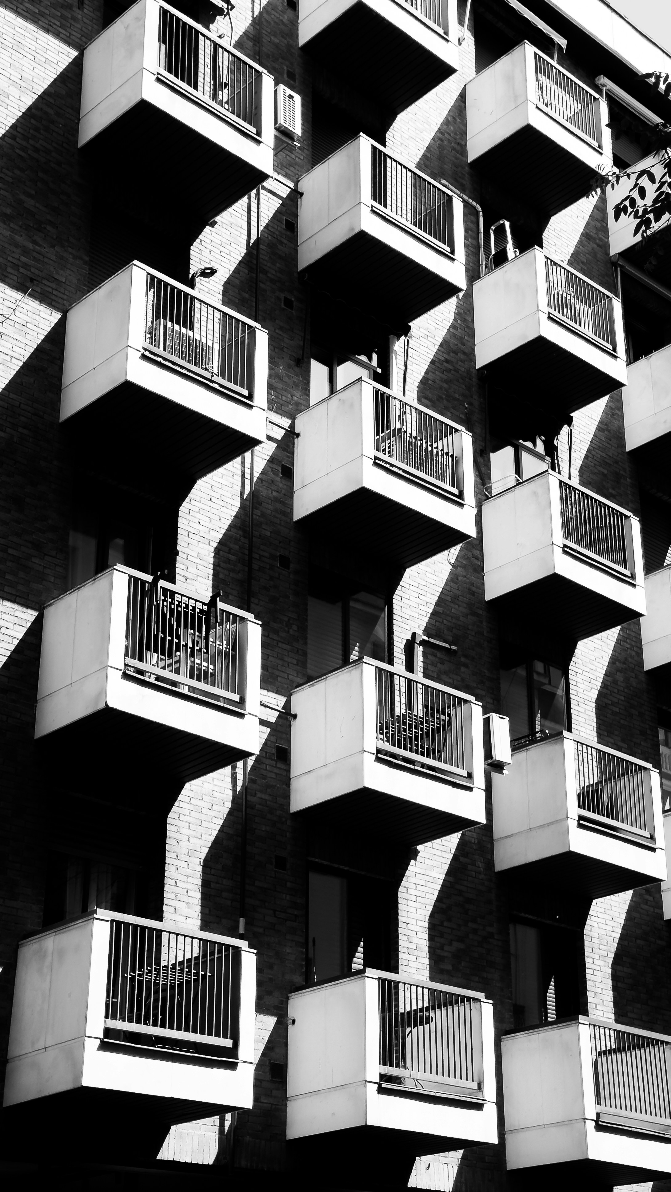 Vertical Grid: A Rhythm of Balconies in Black and White