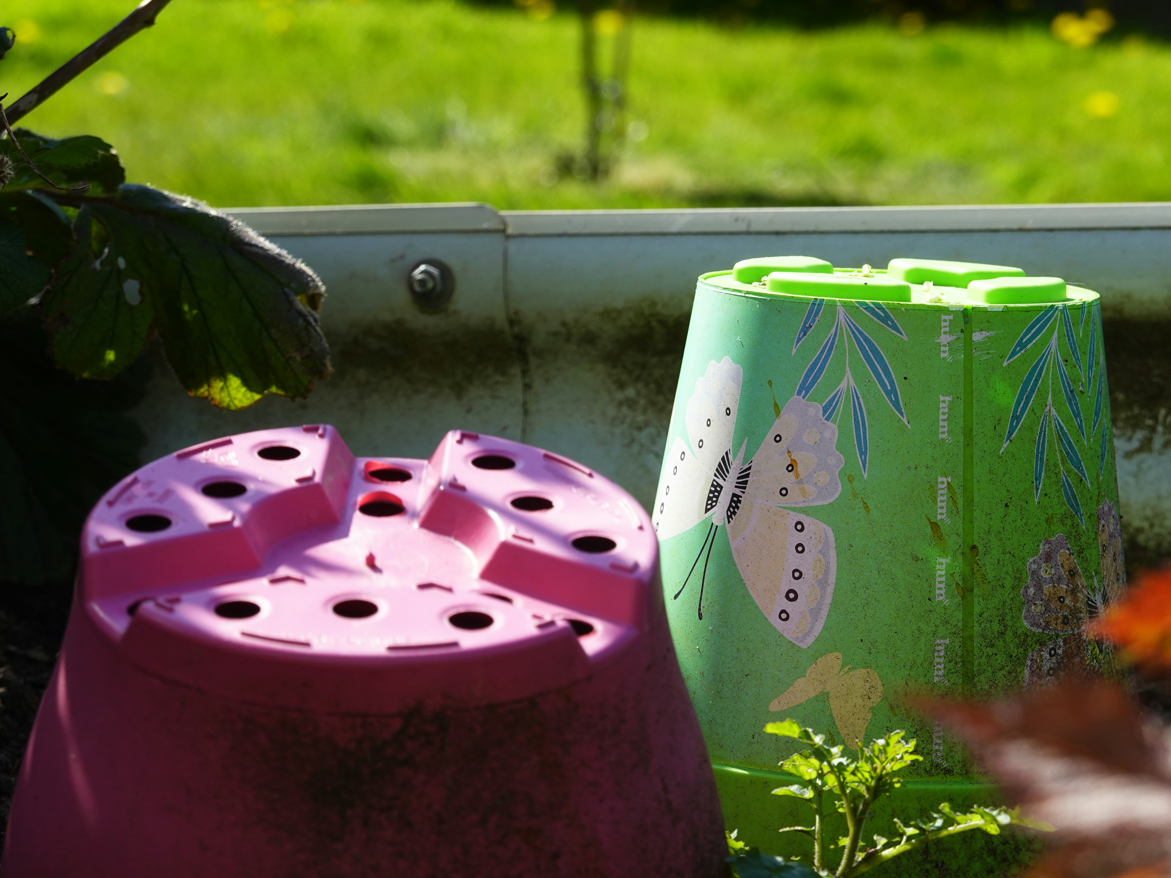 Colorful Plastic Stacks in a Sunlit Garden