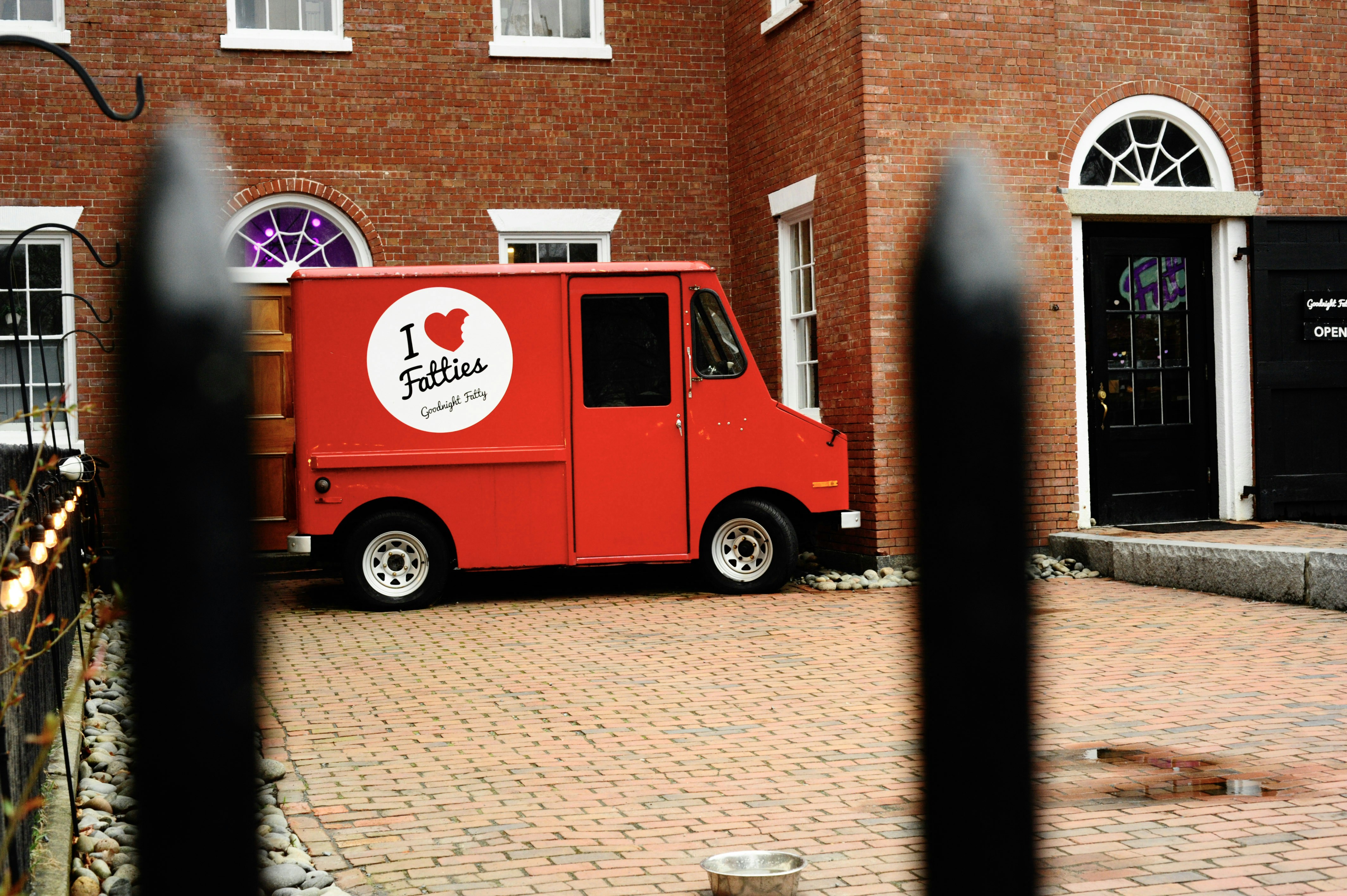 Red van with Love for Freshies in a Brick Courtyard