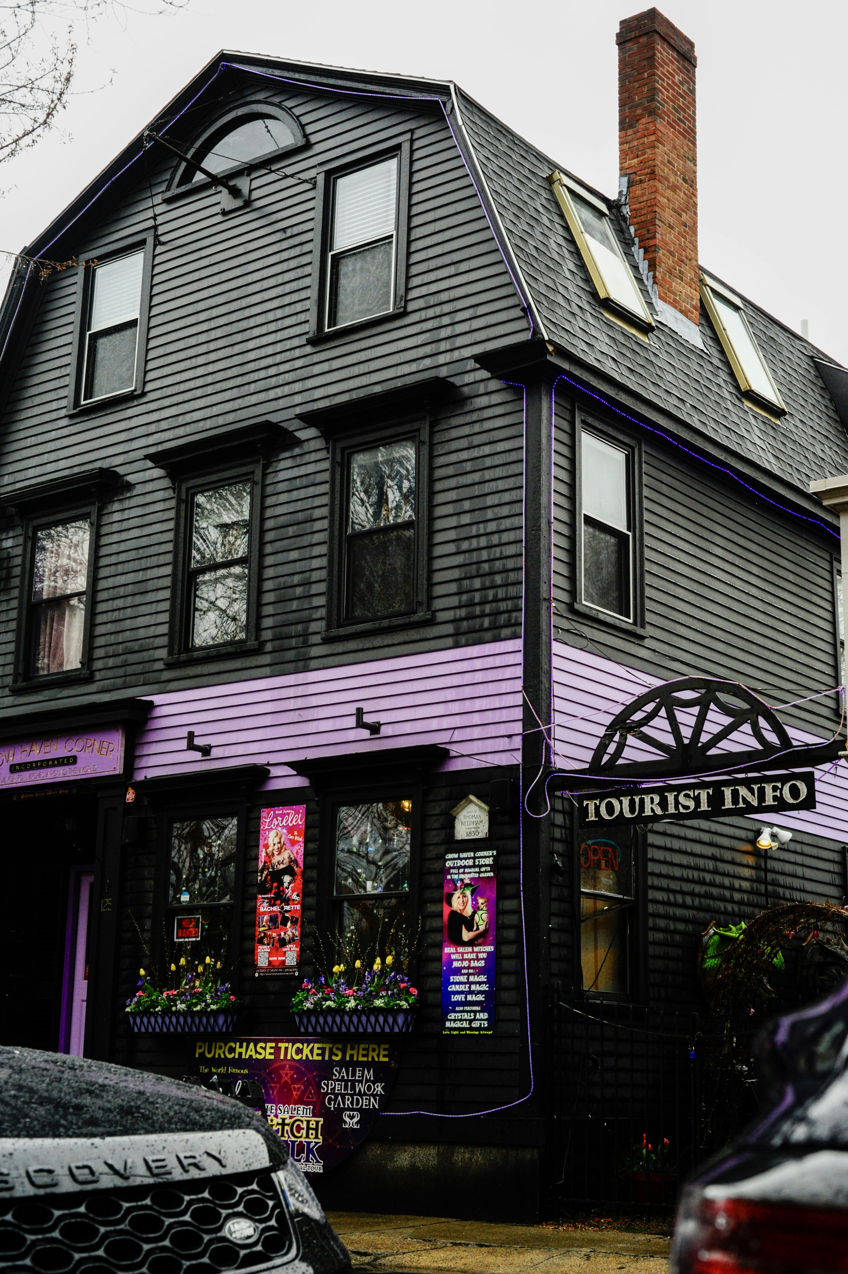 Purple Trim, Dark Facade: A Corner House of Tickets and Tours