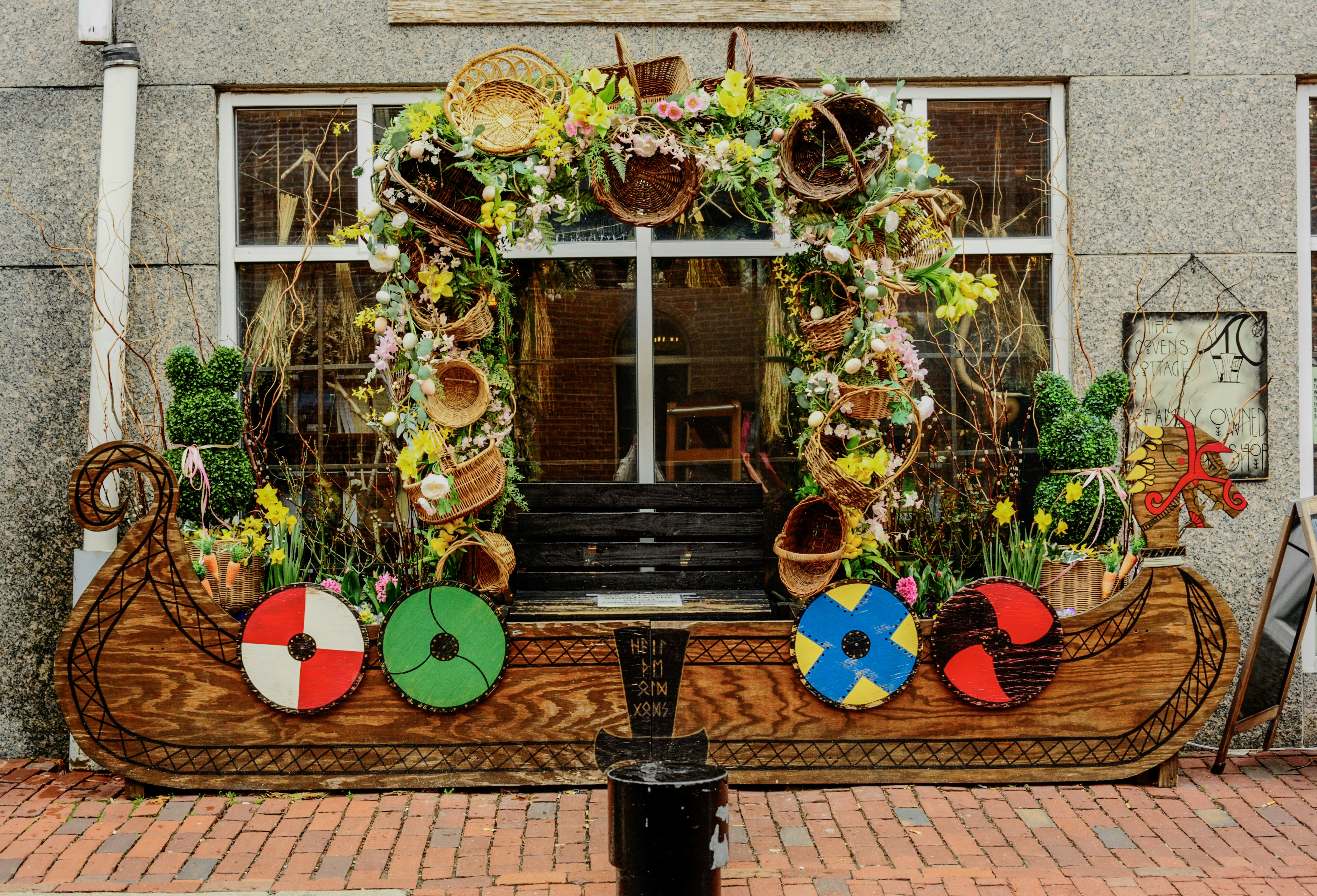 Floral Arch Over a Basket-Boothed Street Display