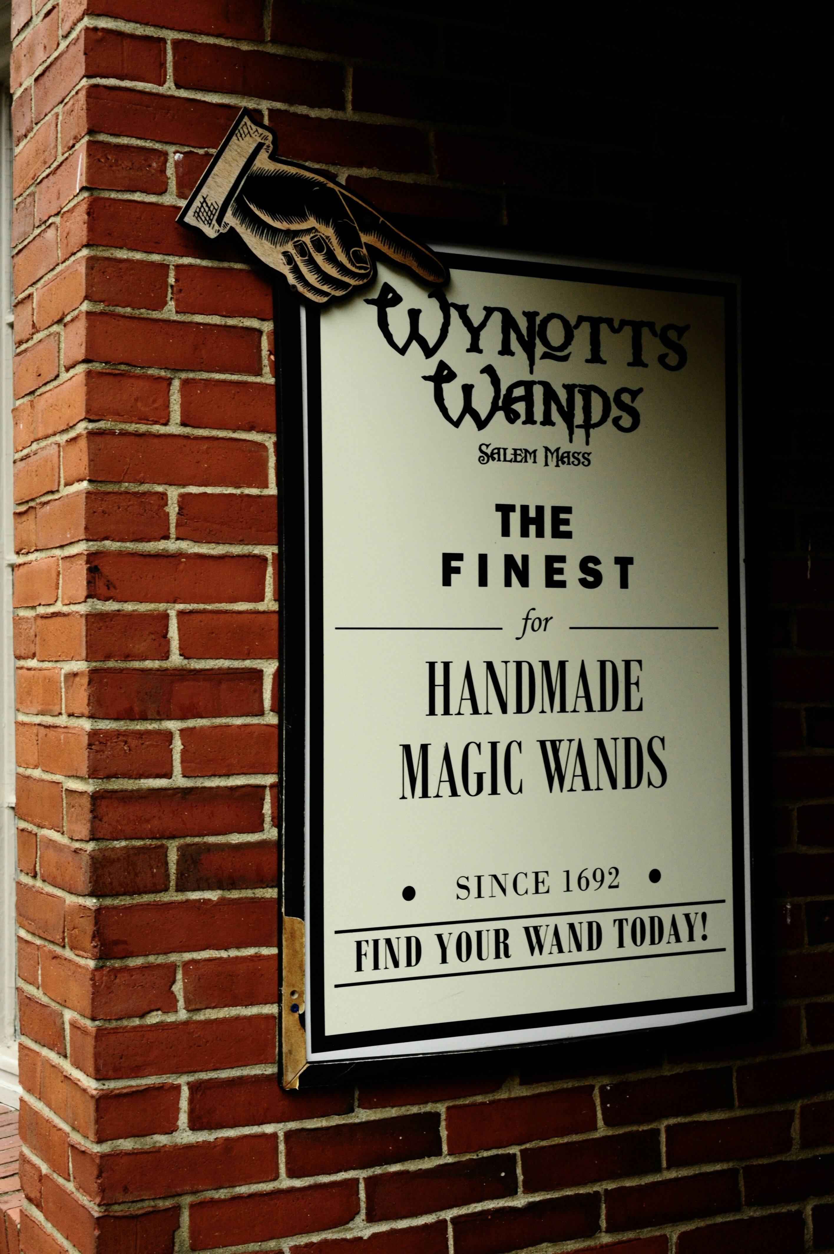 The Hand-Painted Signpost: A Humorous Prop in Brick and Light