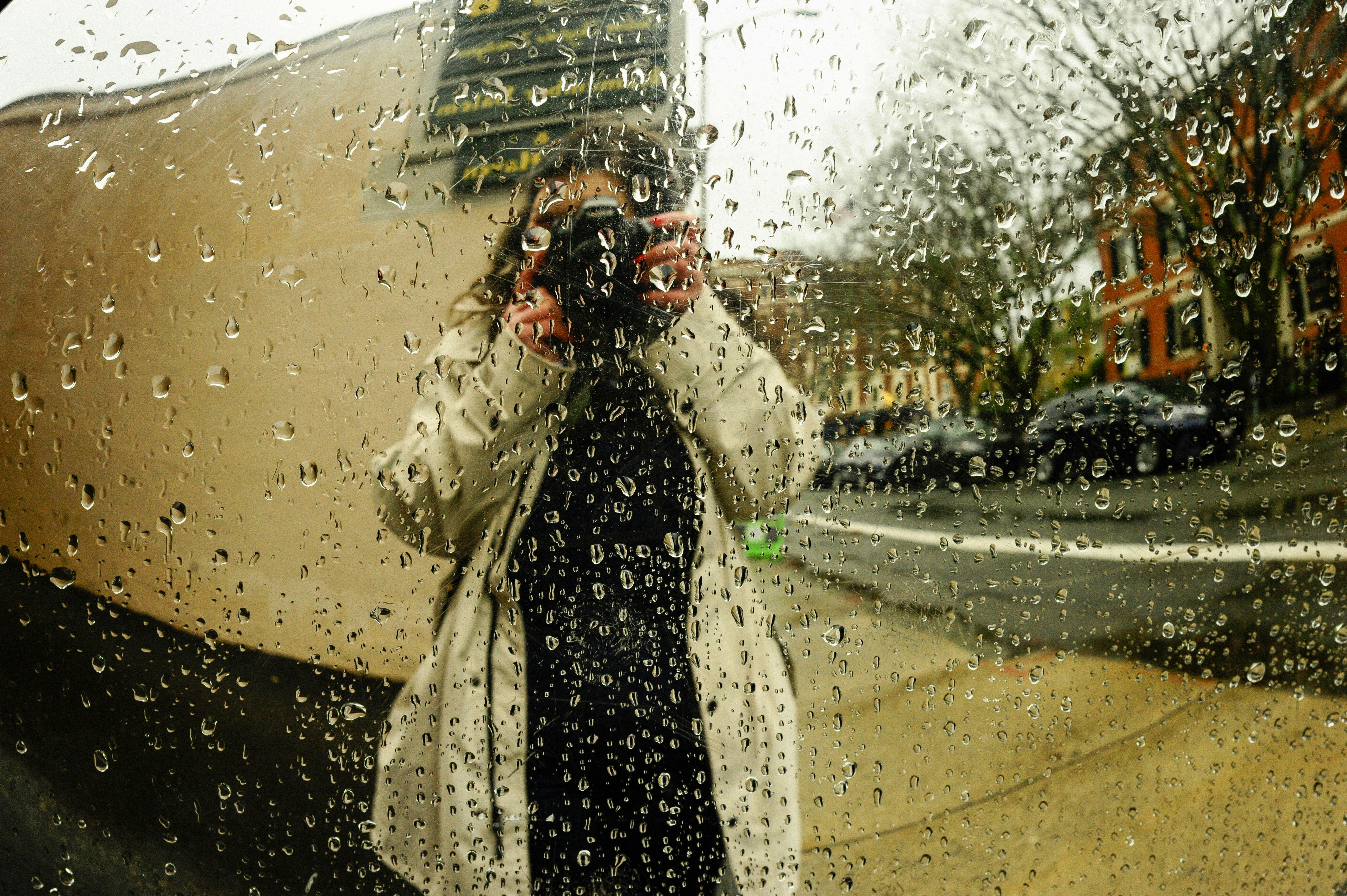 Rain-kissed Self-Portrait Through a Street-Side Window