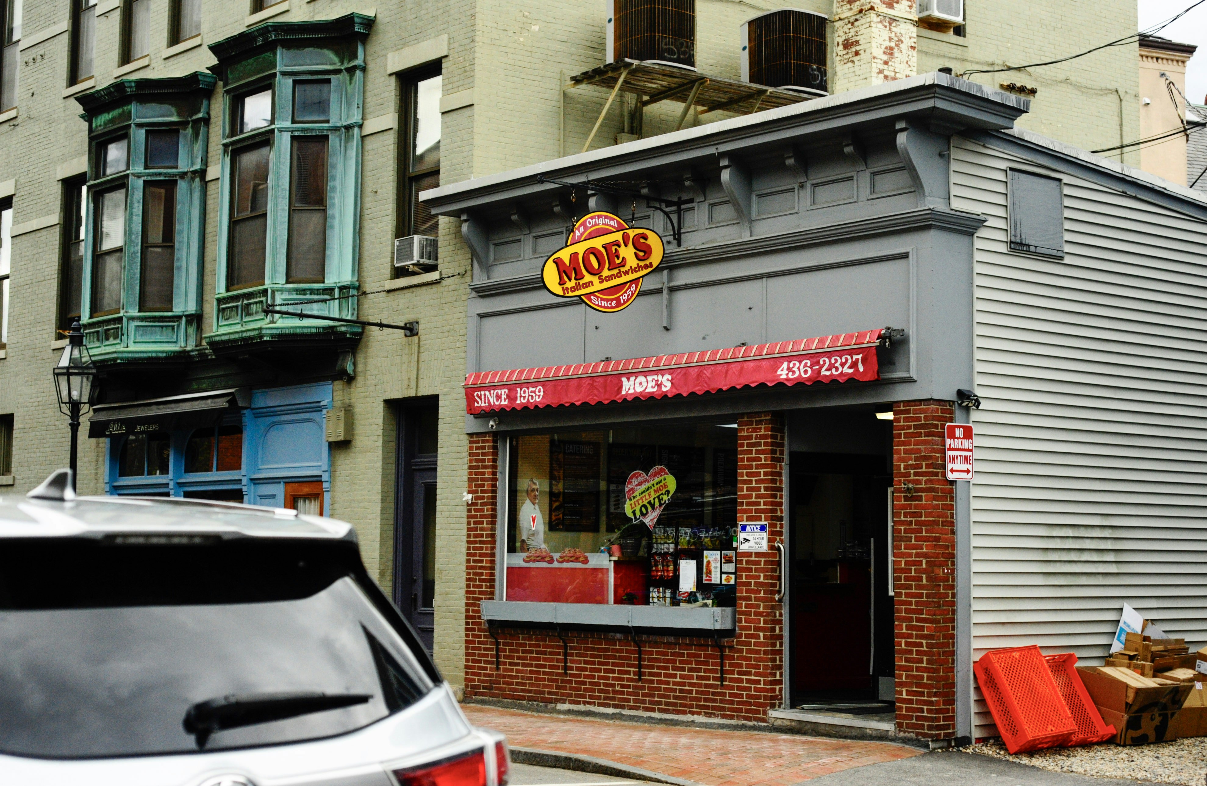 Moe's Corner Store: A Red-Brick Facade in a Quiet City Block