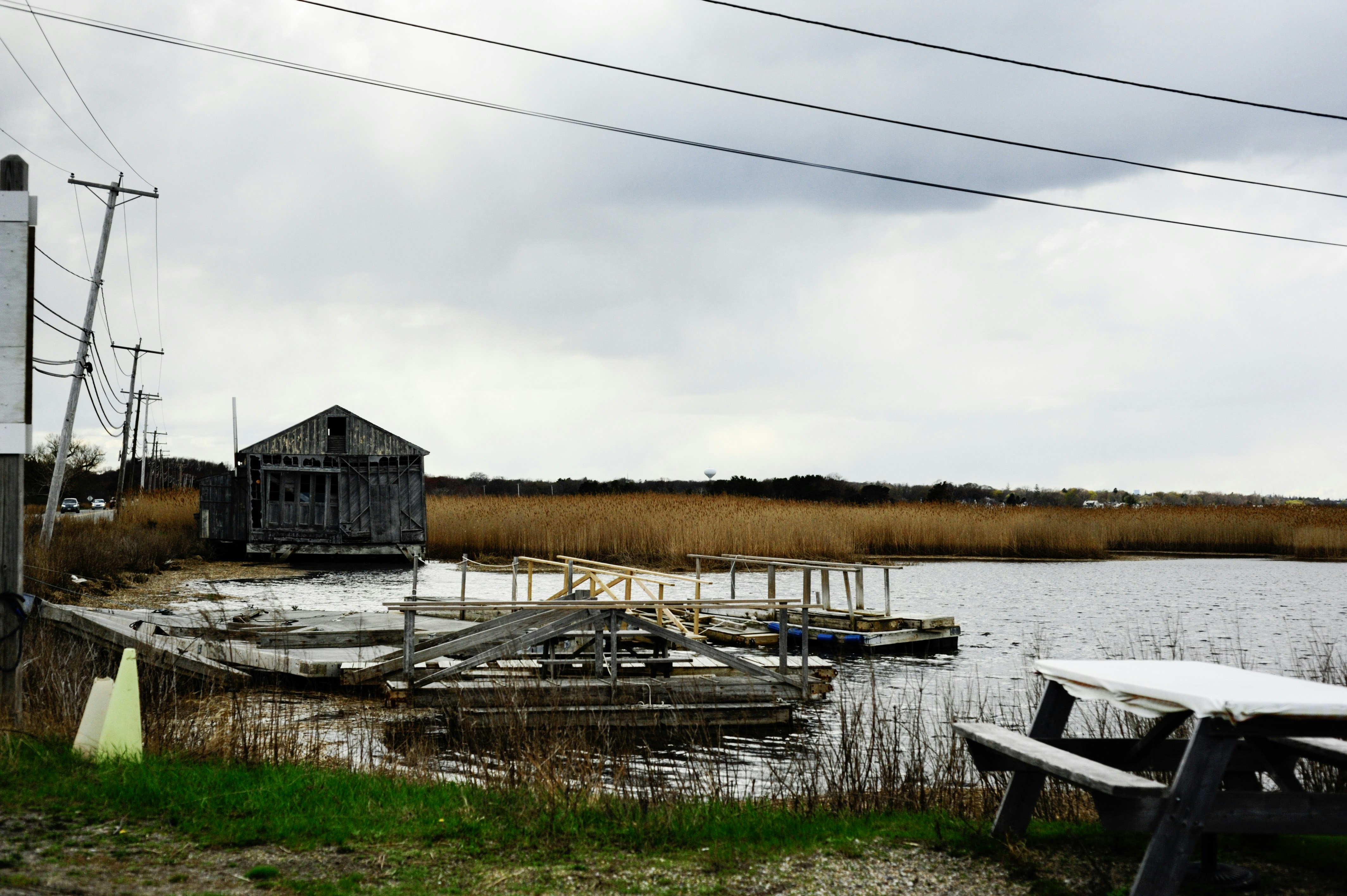 Weathered Dockhouse on a Quiet Waterway