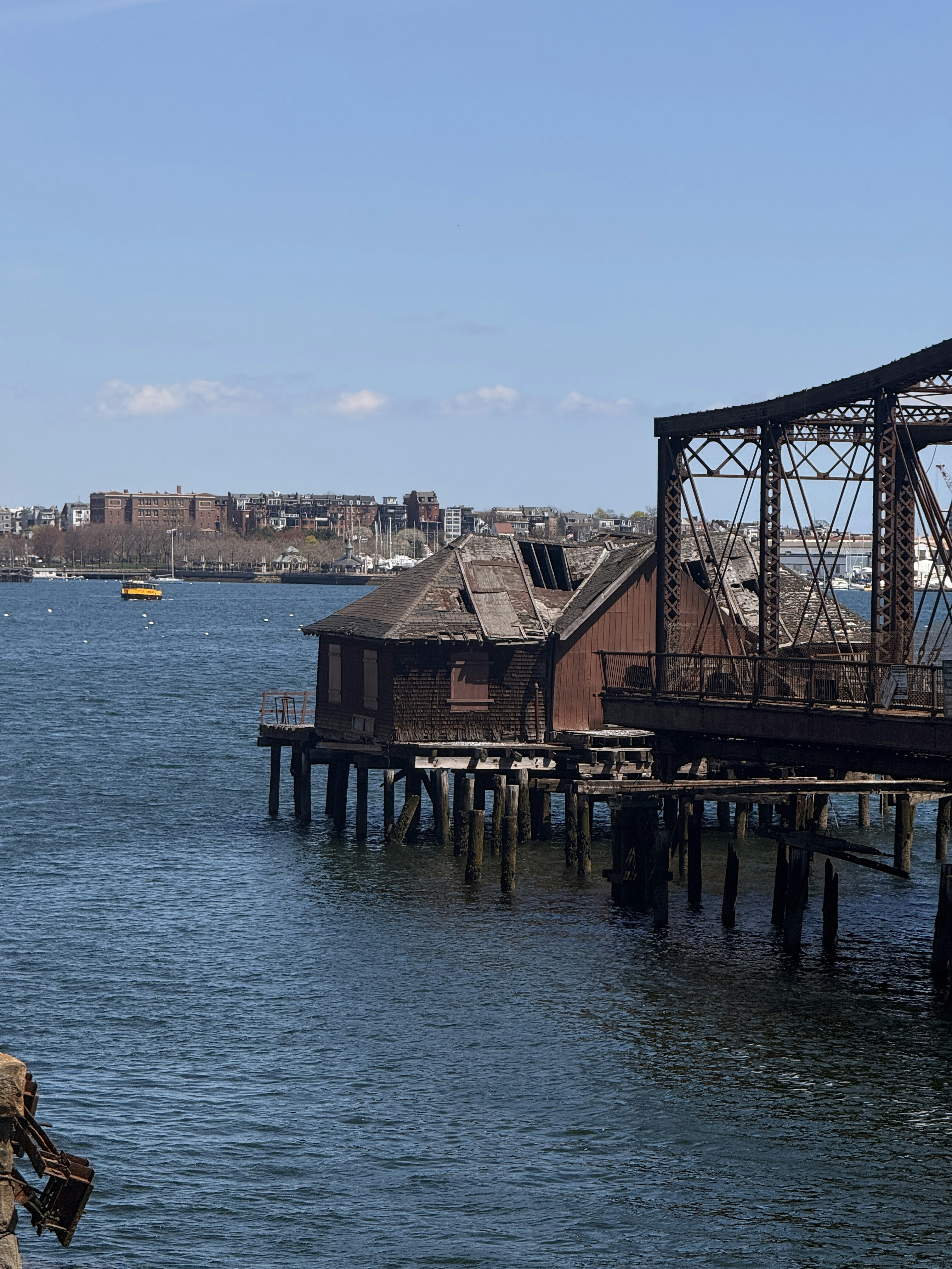 Rusted Pier and Industrial Ruins Amid a Quiet Waterfront