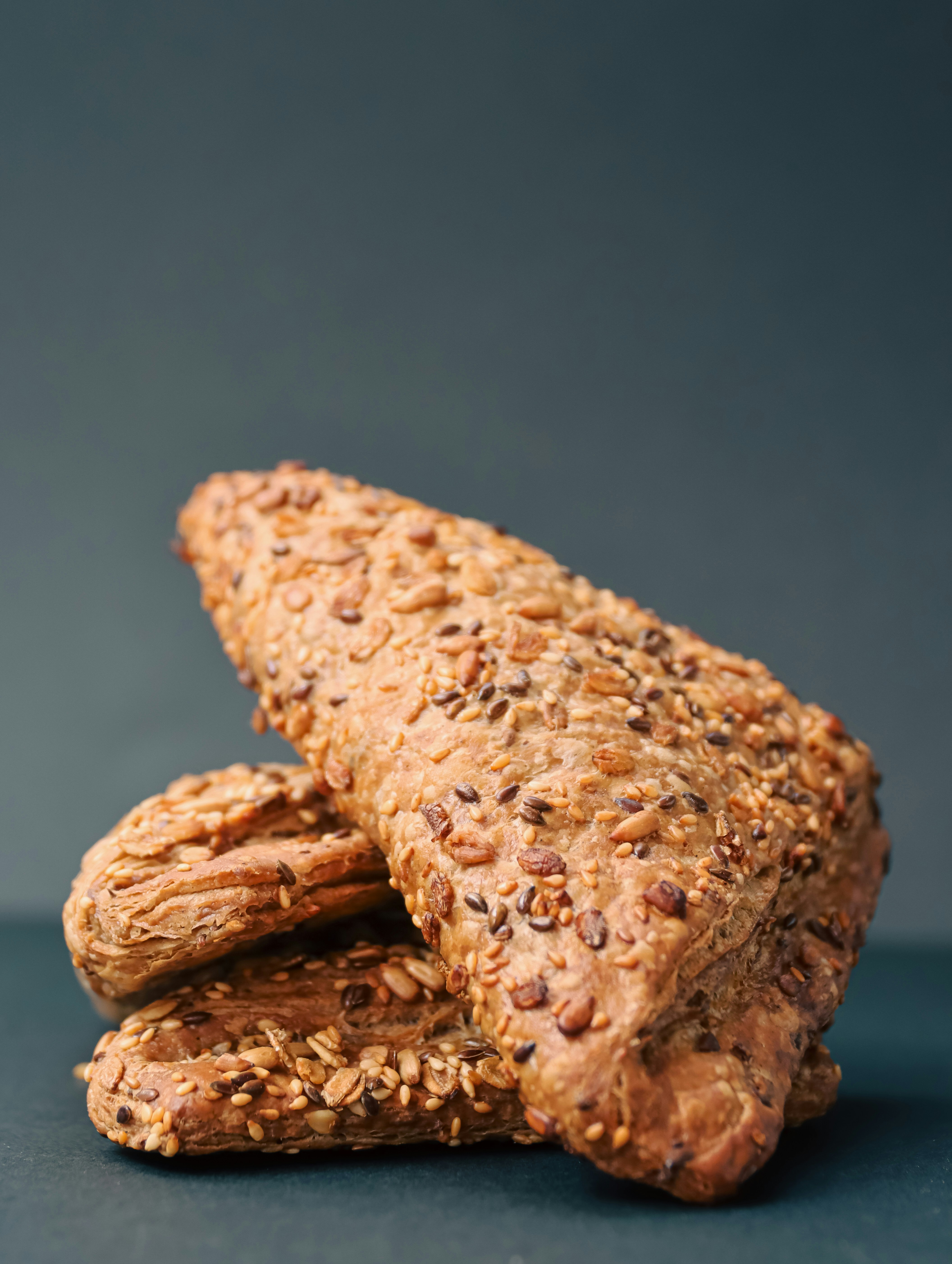 Nutty Crunch: Seeded Pastry Stacks Rest on a Dark Slate