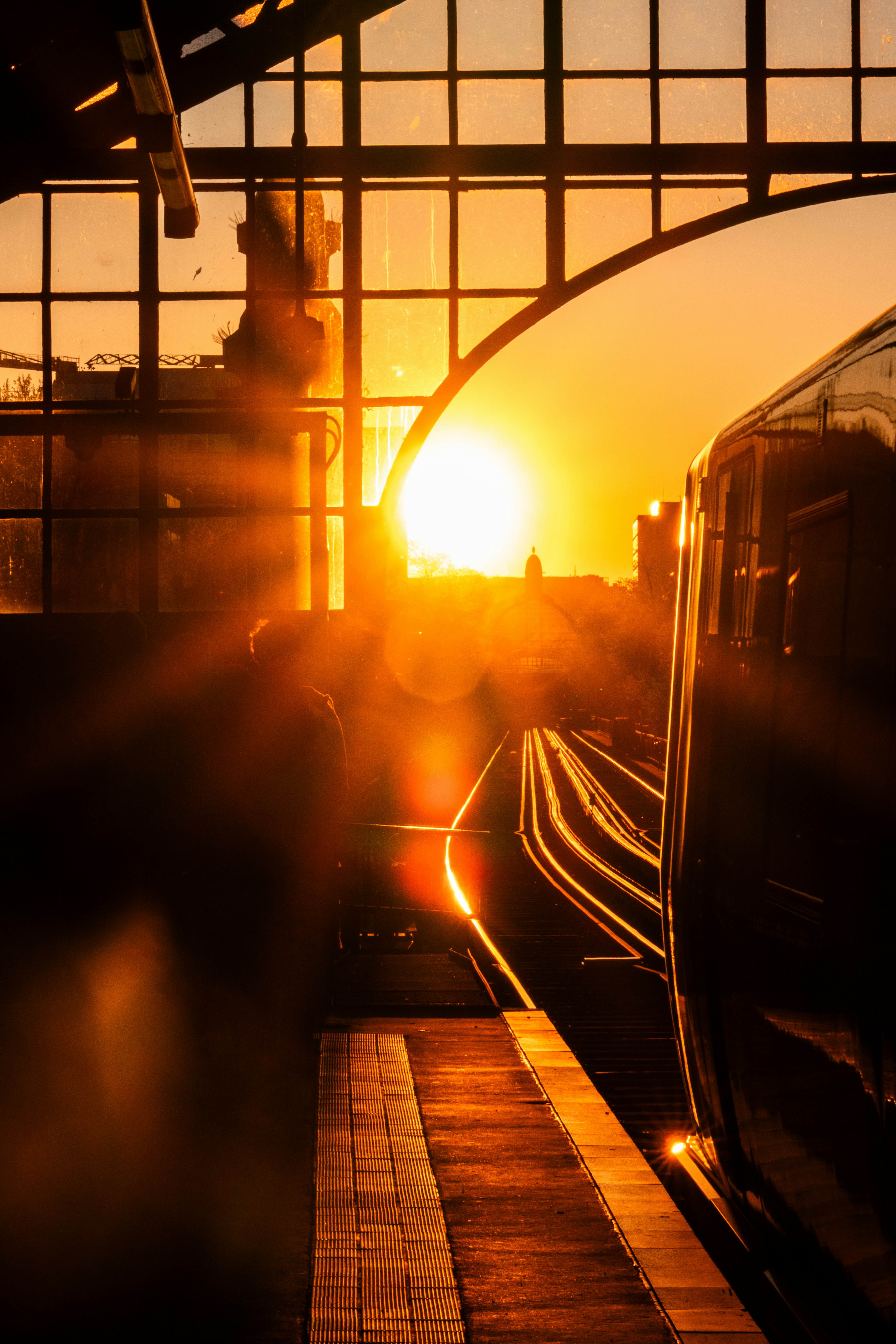 Sunlit Tracks: A Glowing Platform at Dusk Station