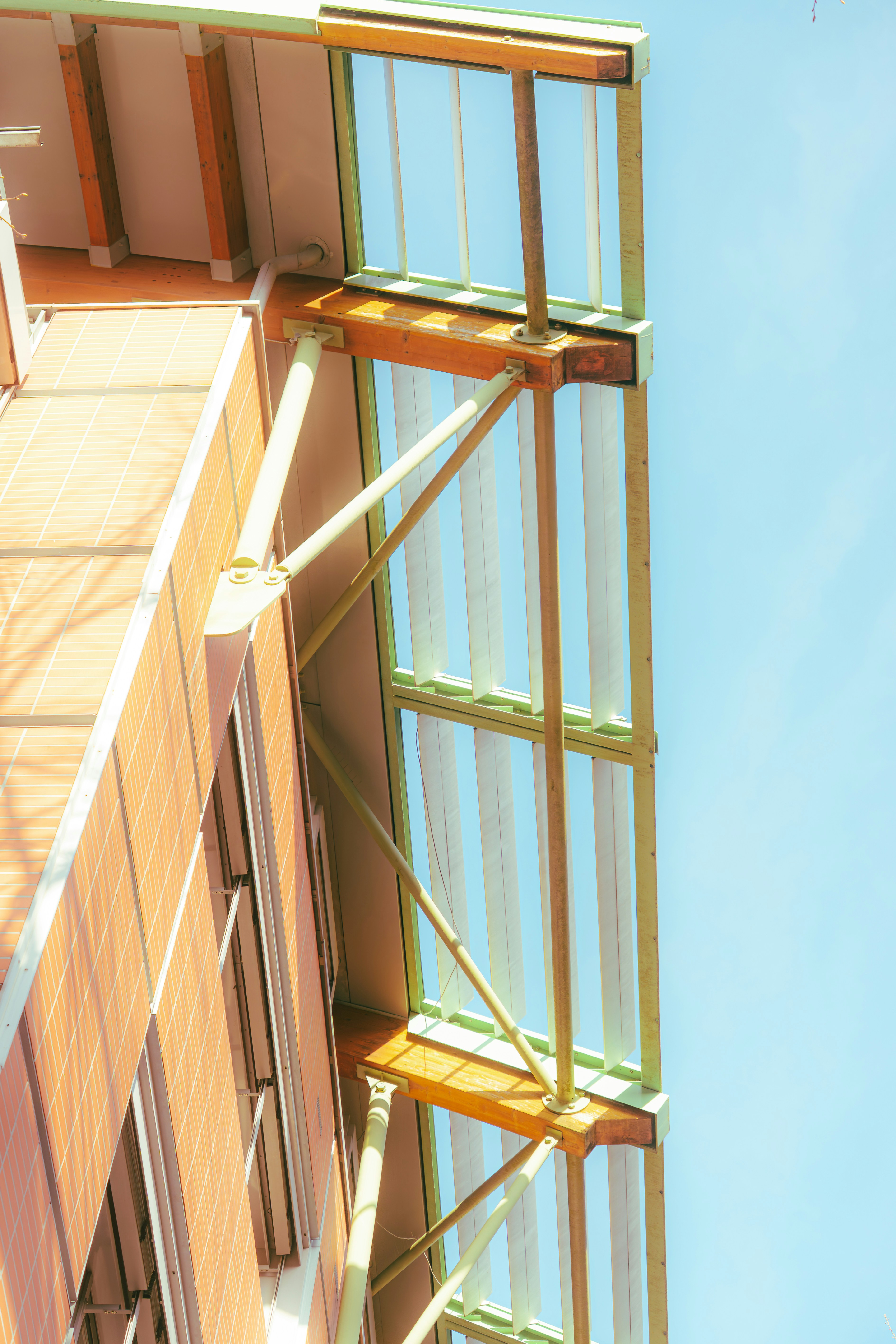 Architectural Prism: Colorful Balcony Rails Reaching Toward the Sky