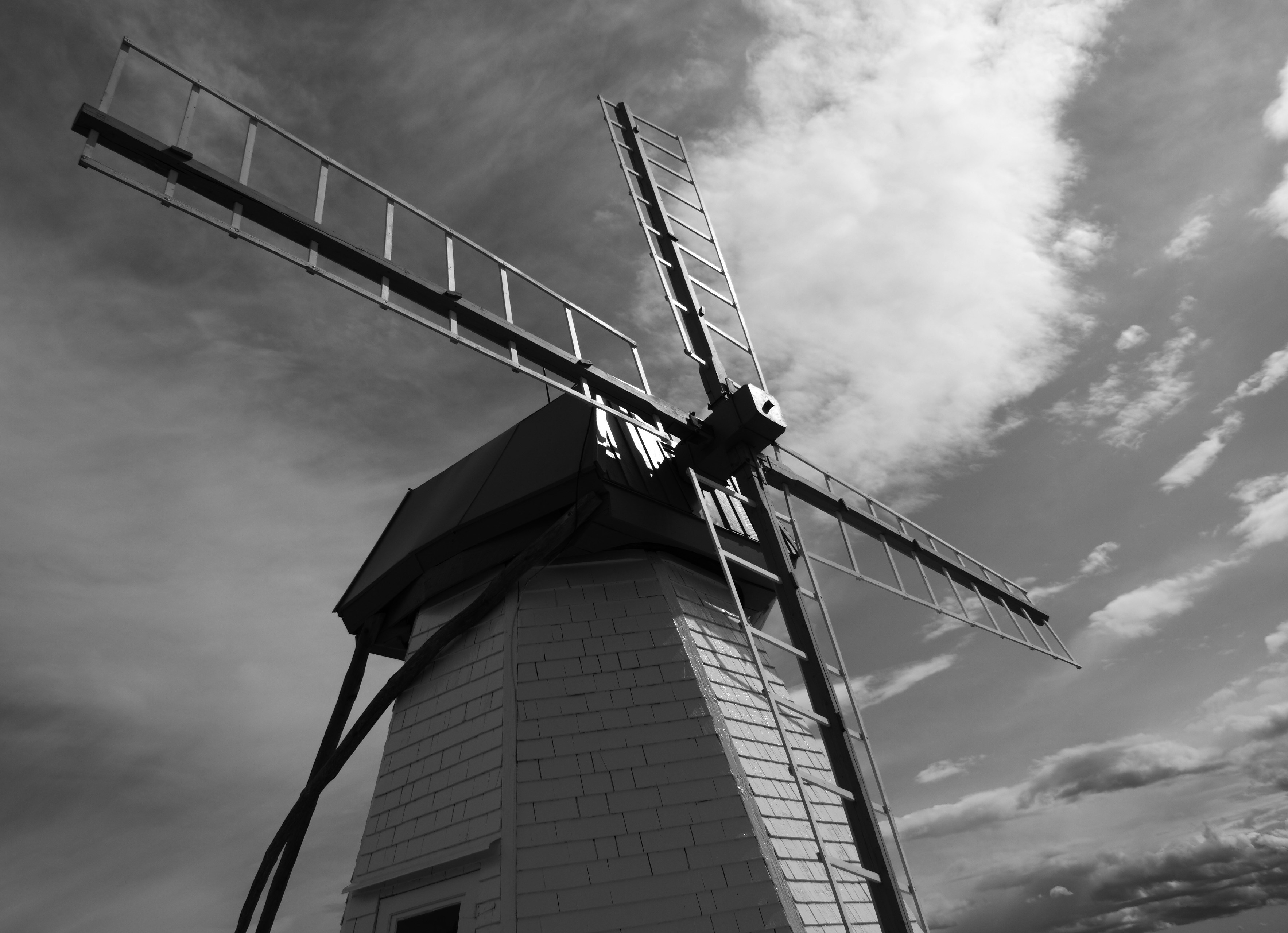 Windmill at Dawn: A Silent Sentinel Against the Sky
