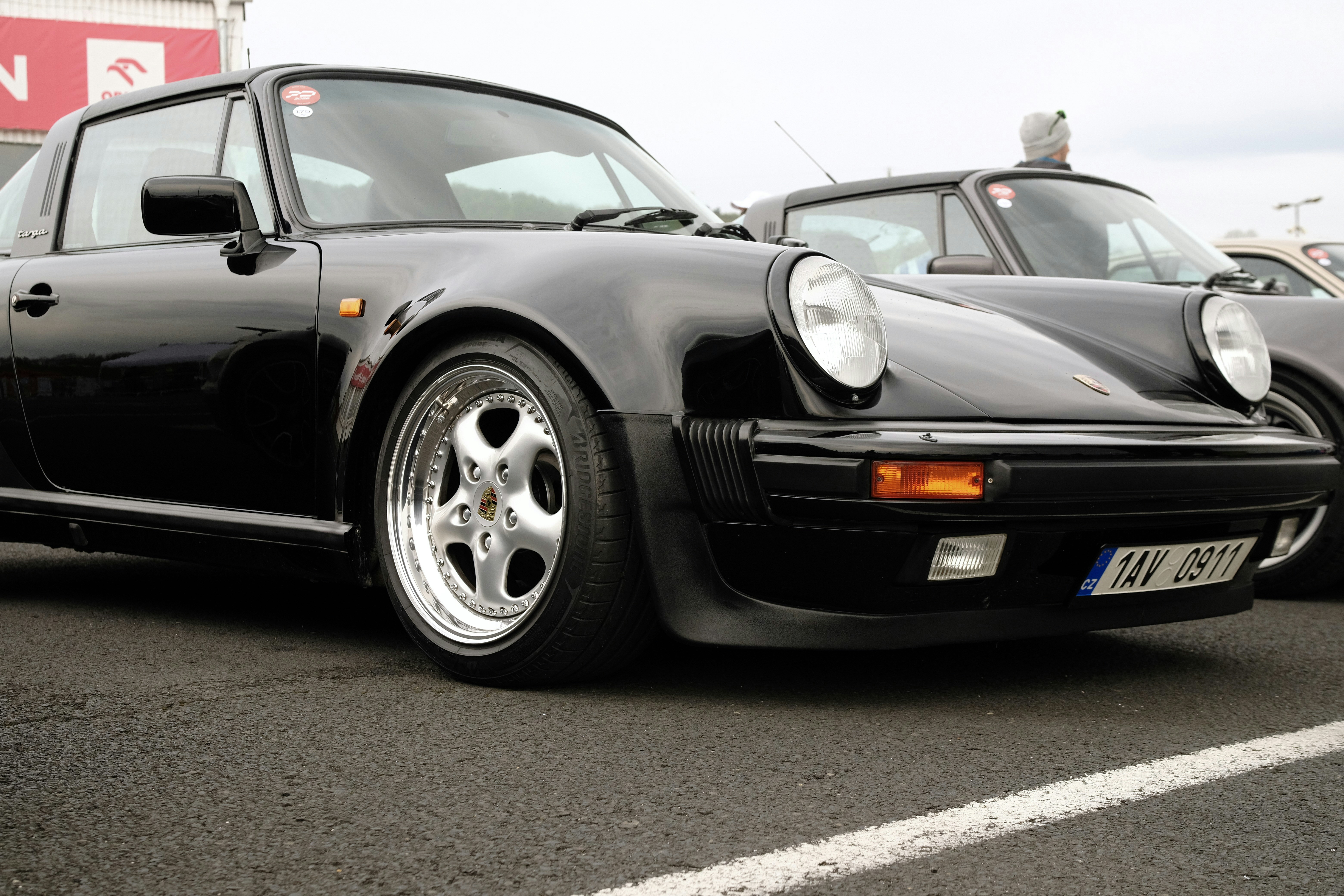 Chrome and Curves: A Classic Porsche Stance in the Lot