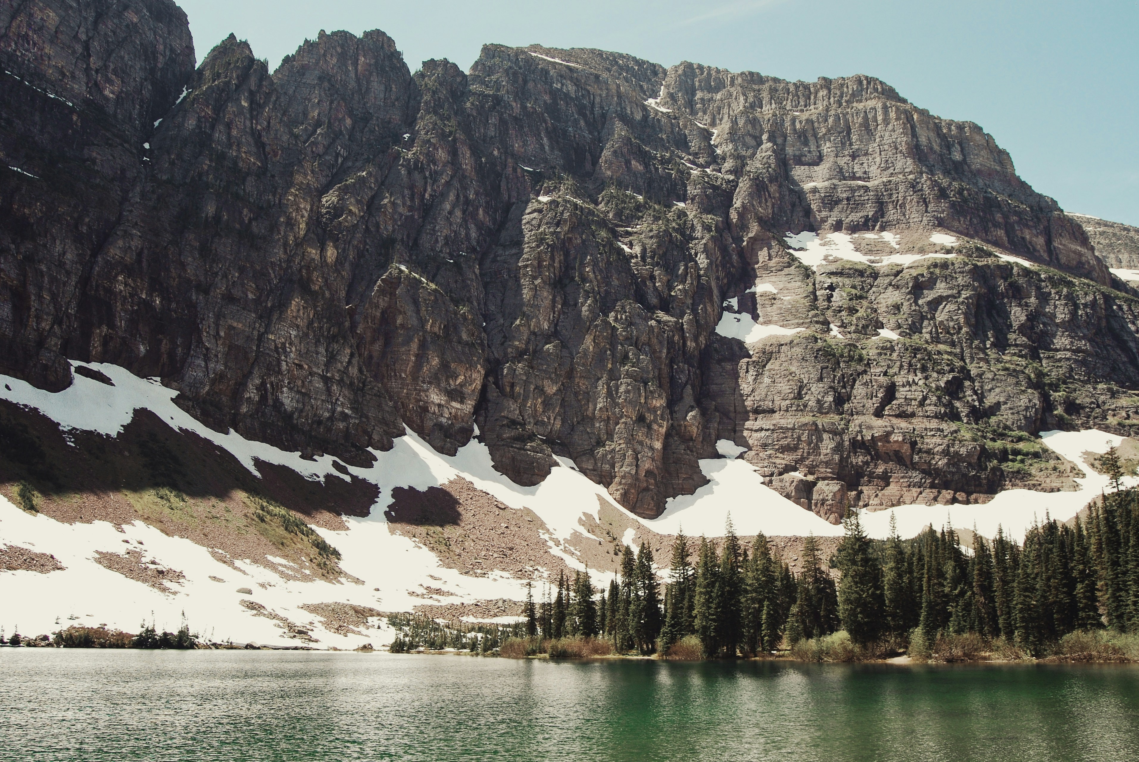 Snow-touched Peaks Over a Serene Alpine Lake
