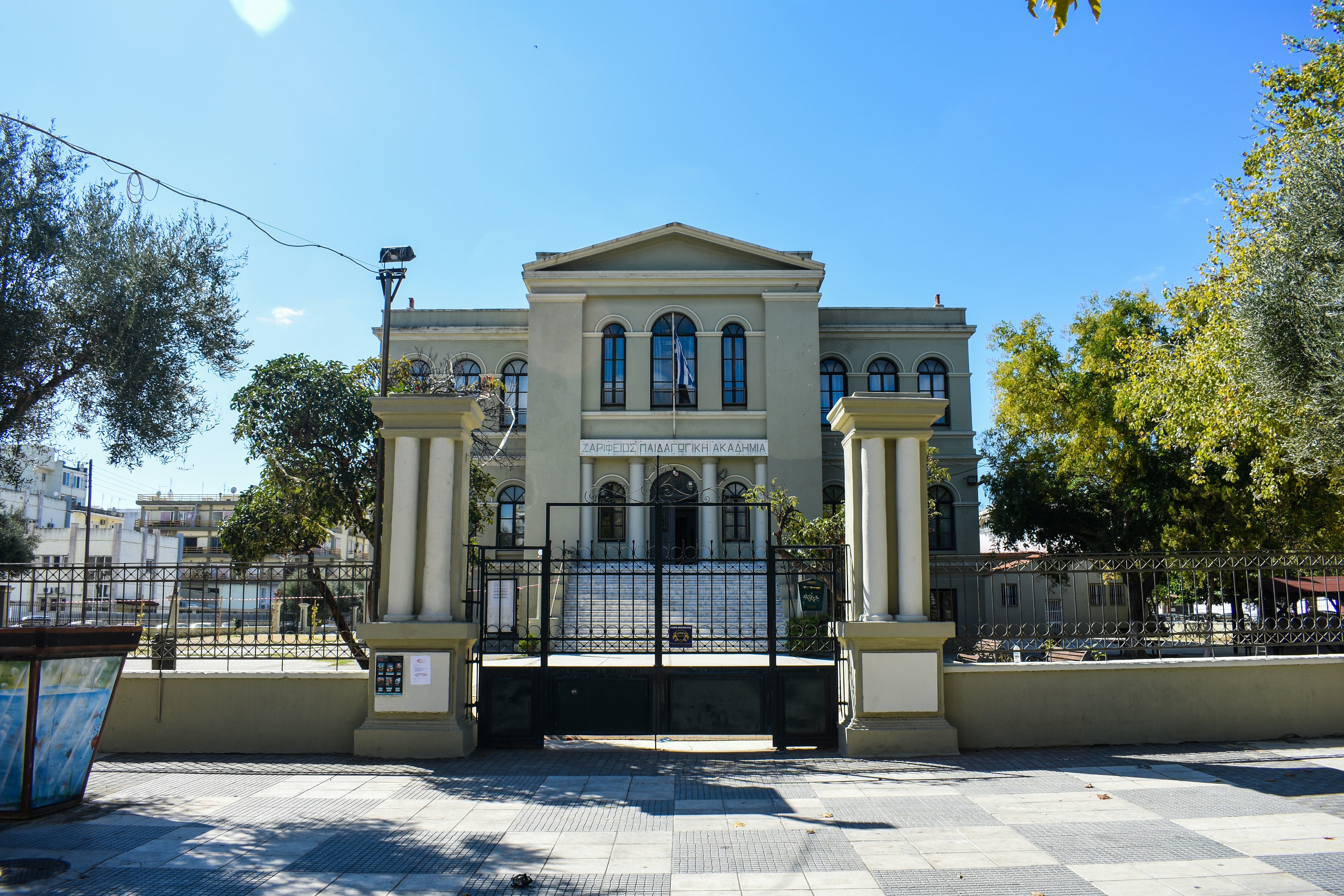 Gated Heritage: neoclassical mansion behind a wrought-iron embrace