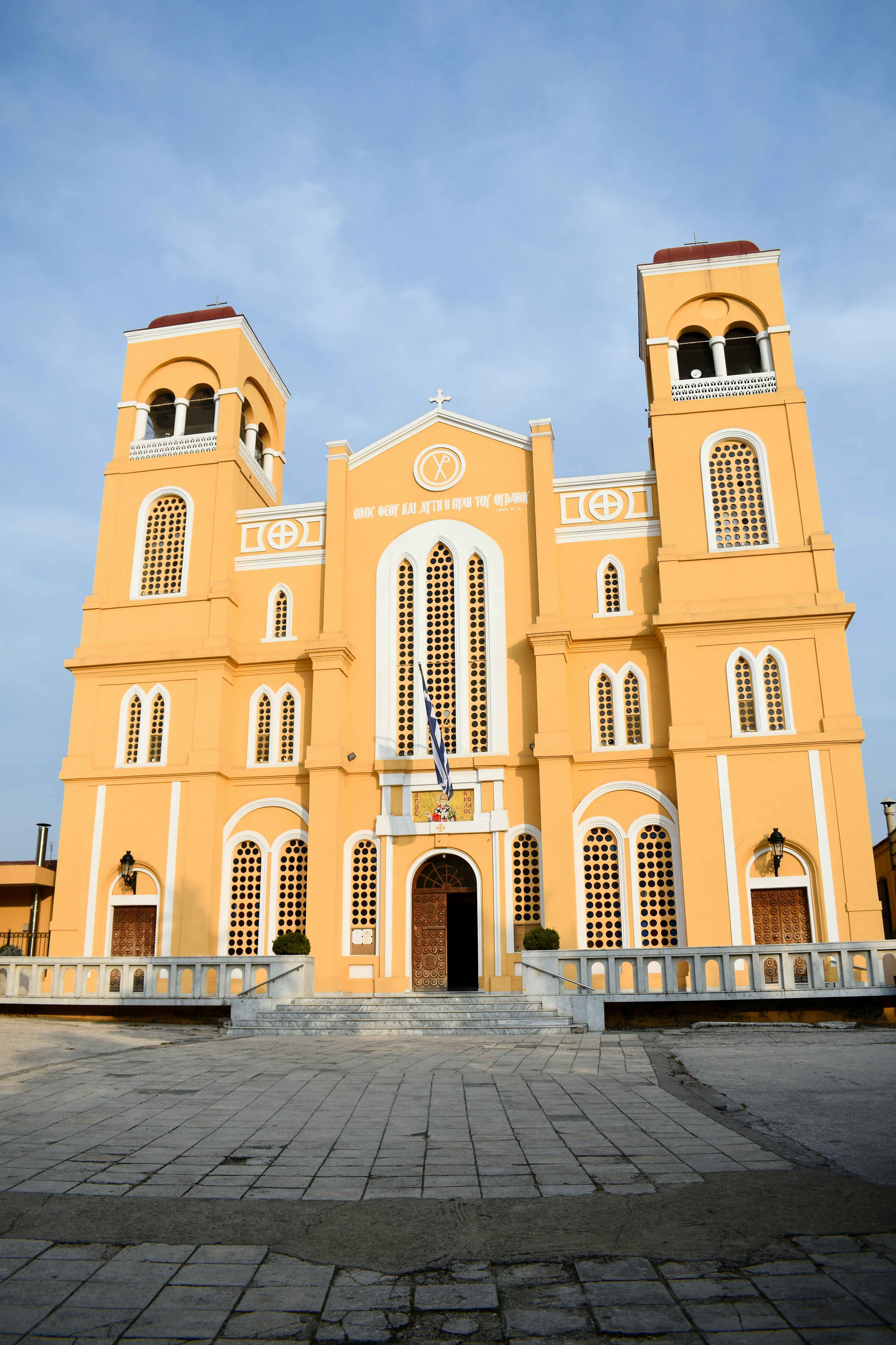 Sunlit Basilica of warm yellow Facades Rising Under a Clear Sky
