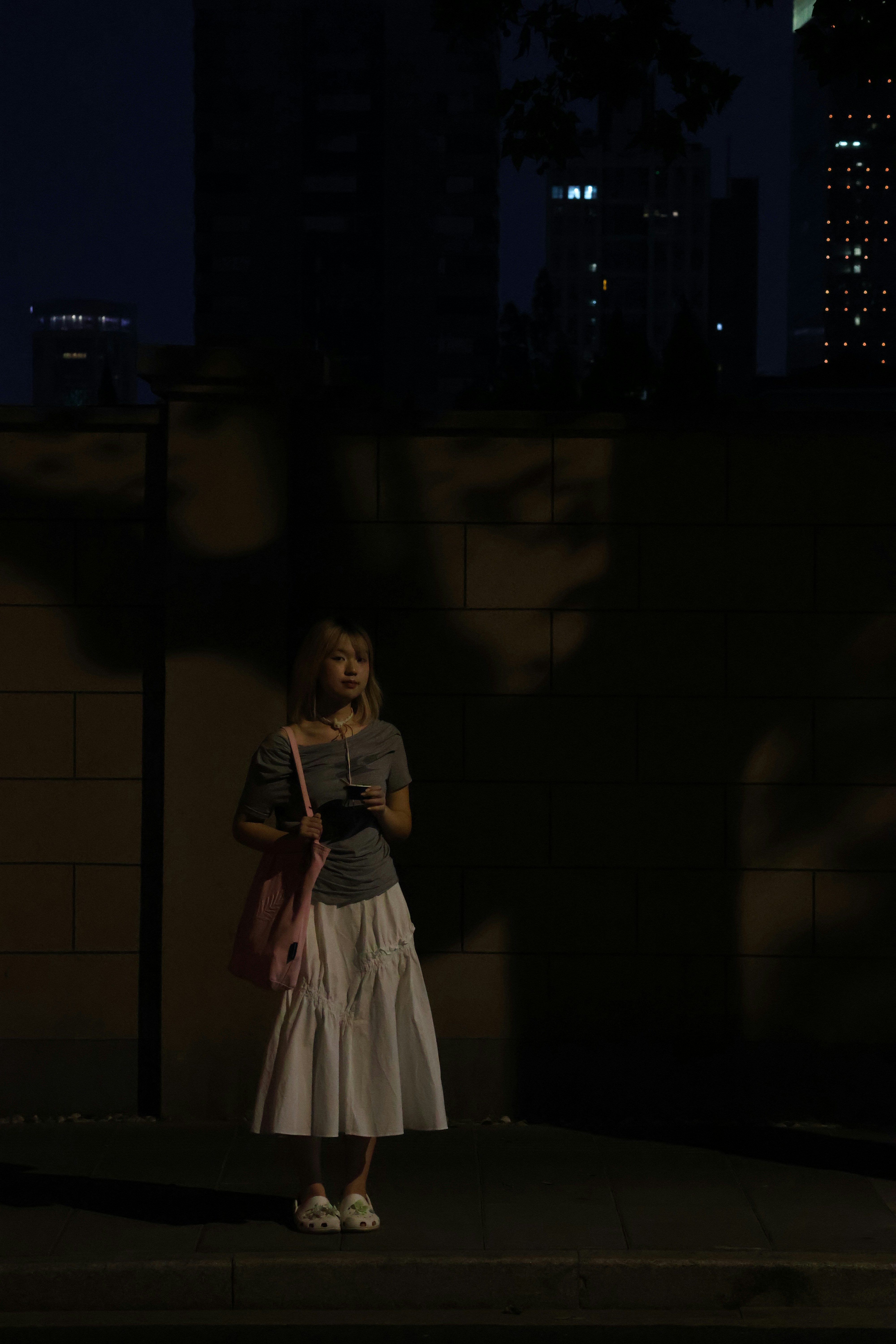 Nightfall on the Pier: A Quiet Portrait by City Shadows