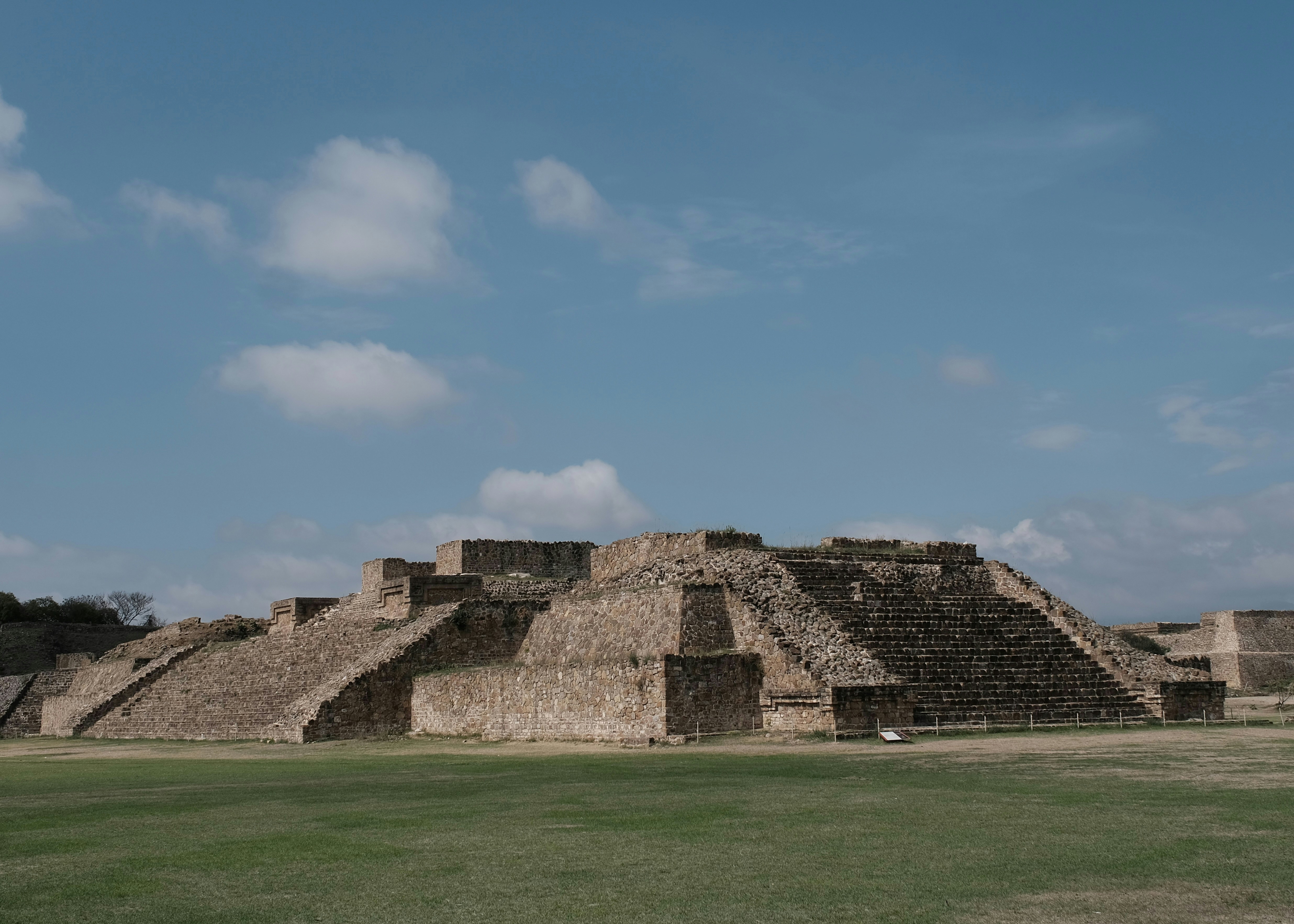 Steps of Time: Sunlit Terraced ruins under a Wide Sky