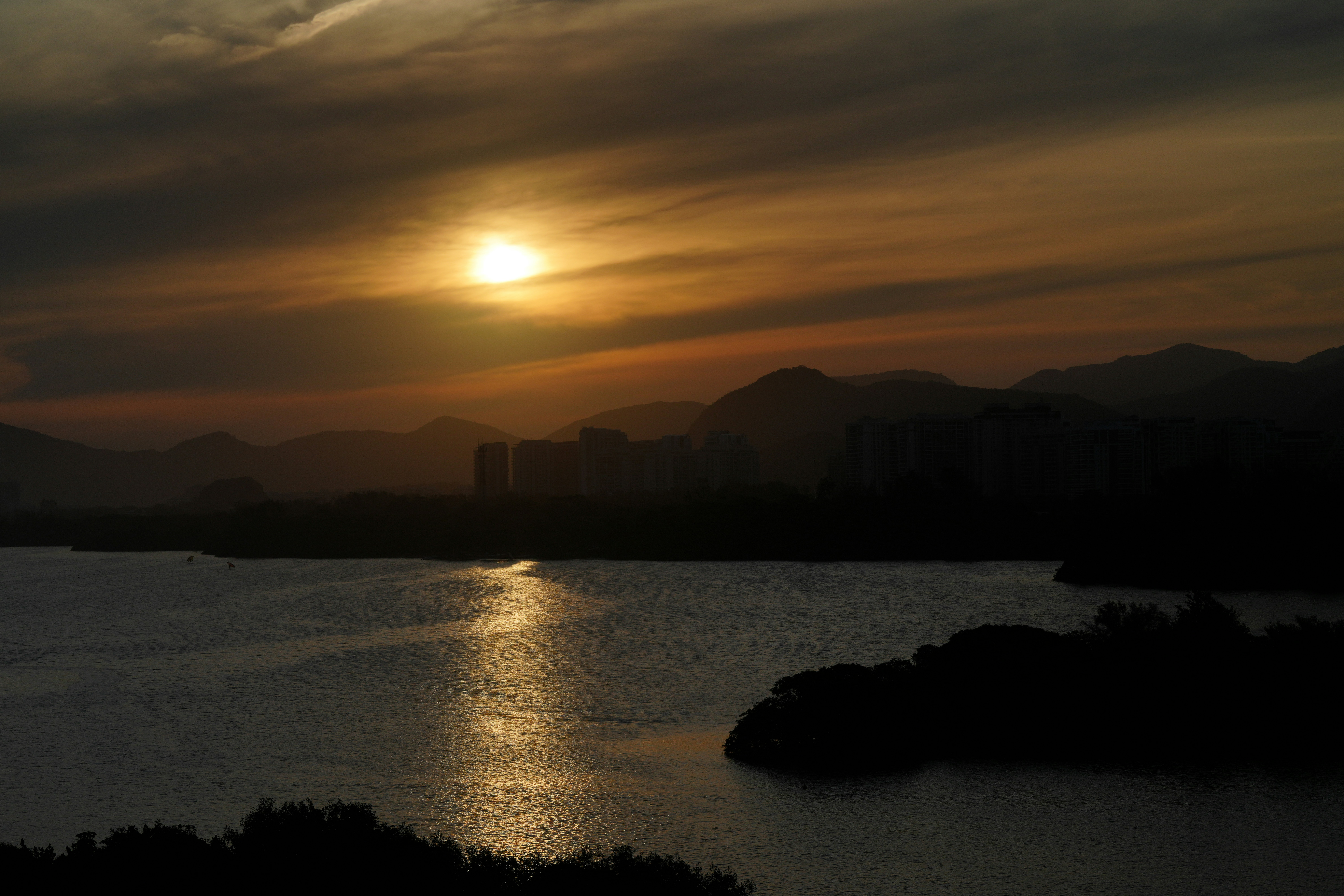 Horizon Gleam at Dusk Over Quiet Waters