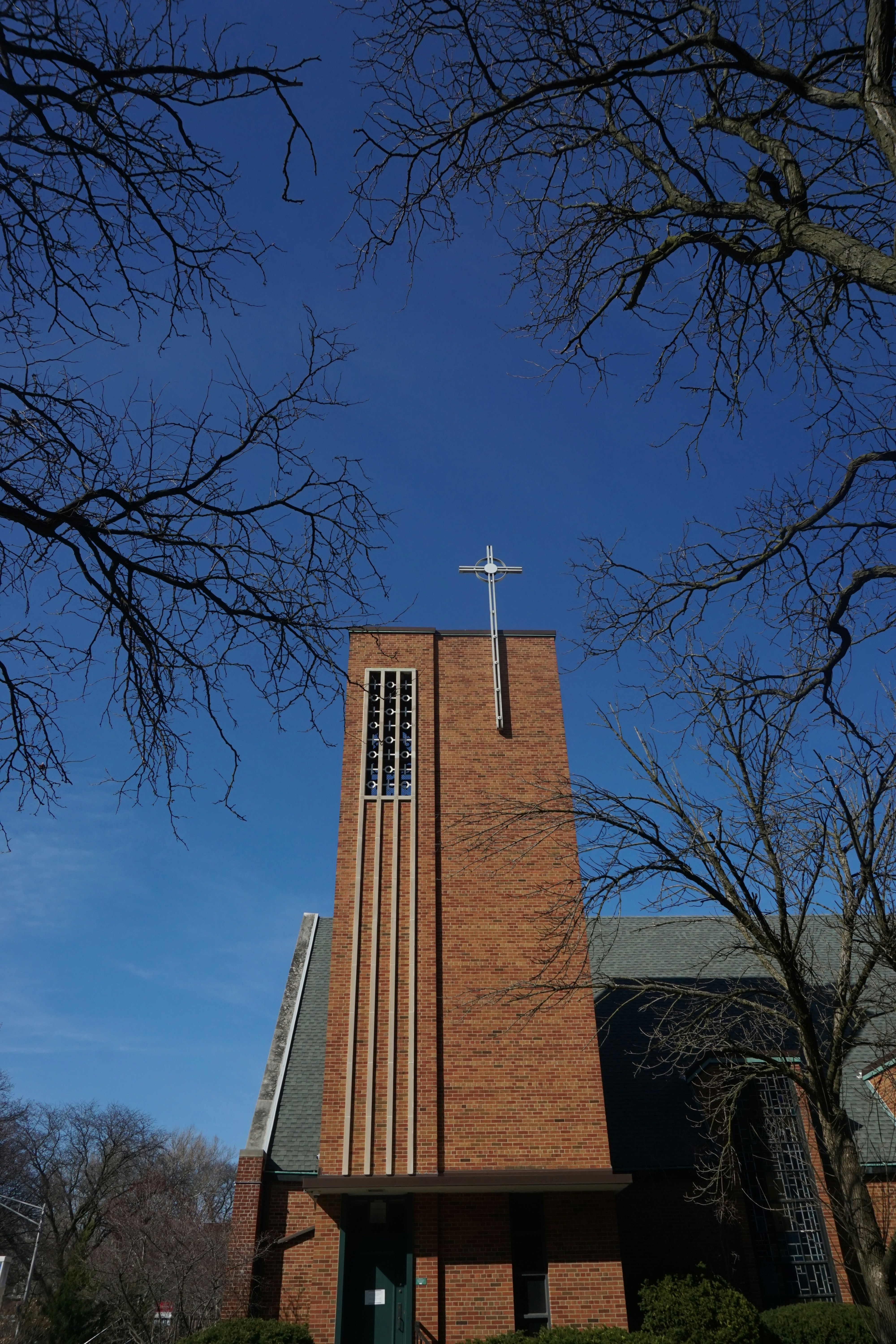 Brick Chapel Tower Reaching Toward a Clear Winter Sky