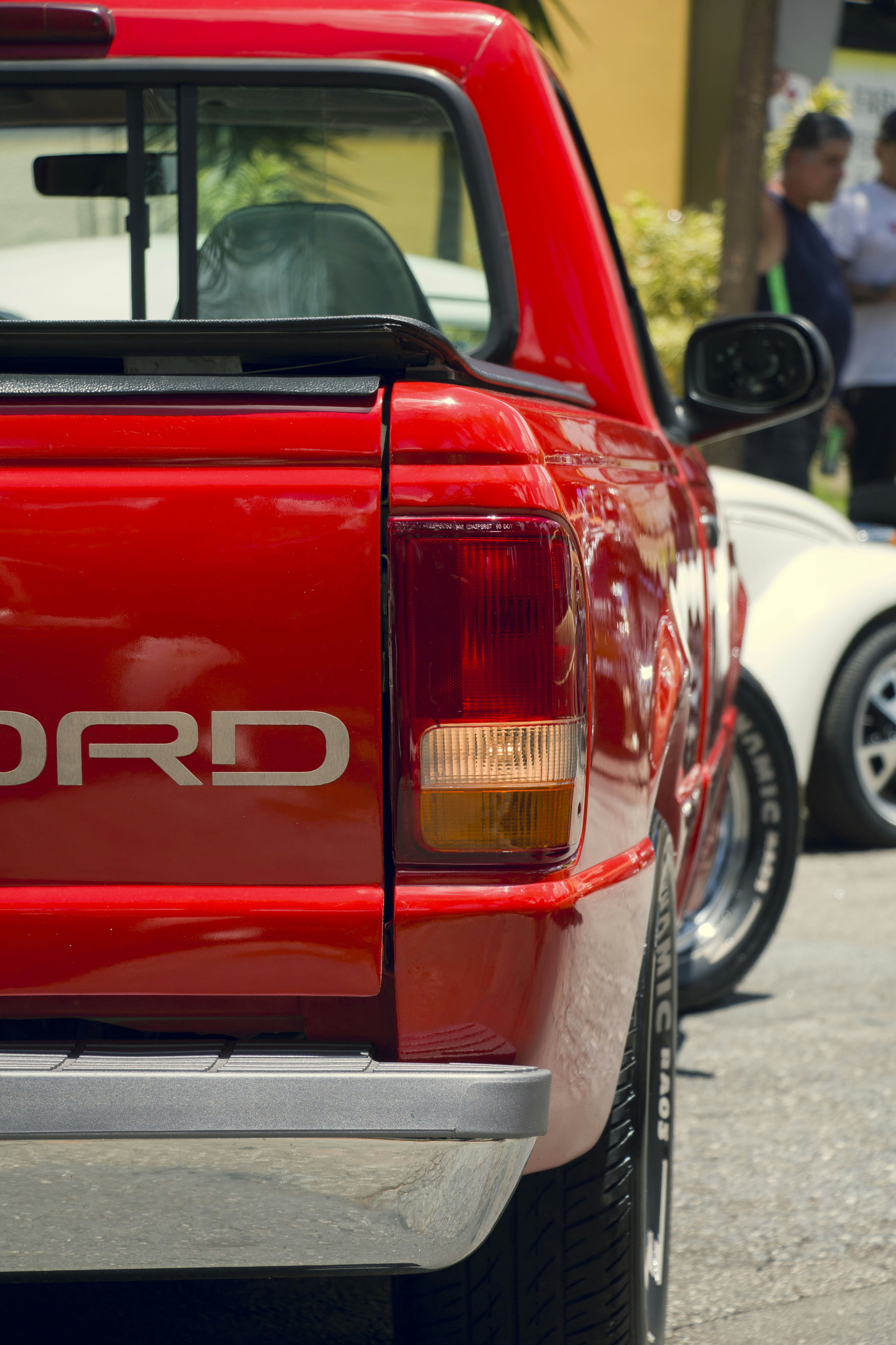Red Bull, Red Truck: A Close-Up of the Tailgate Glint