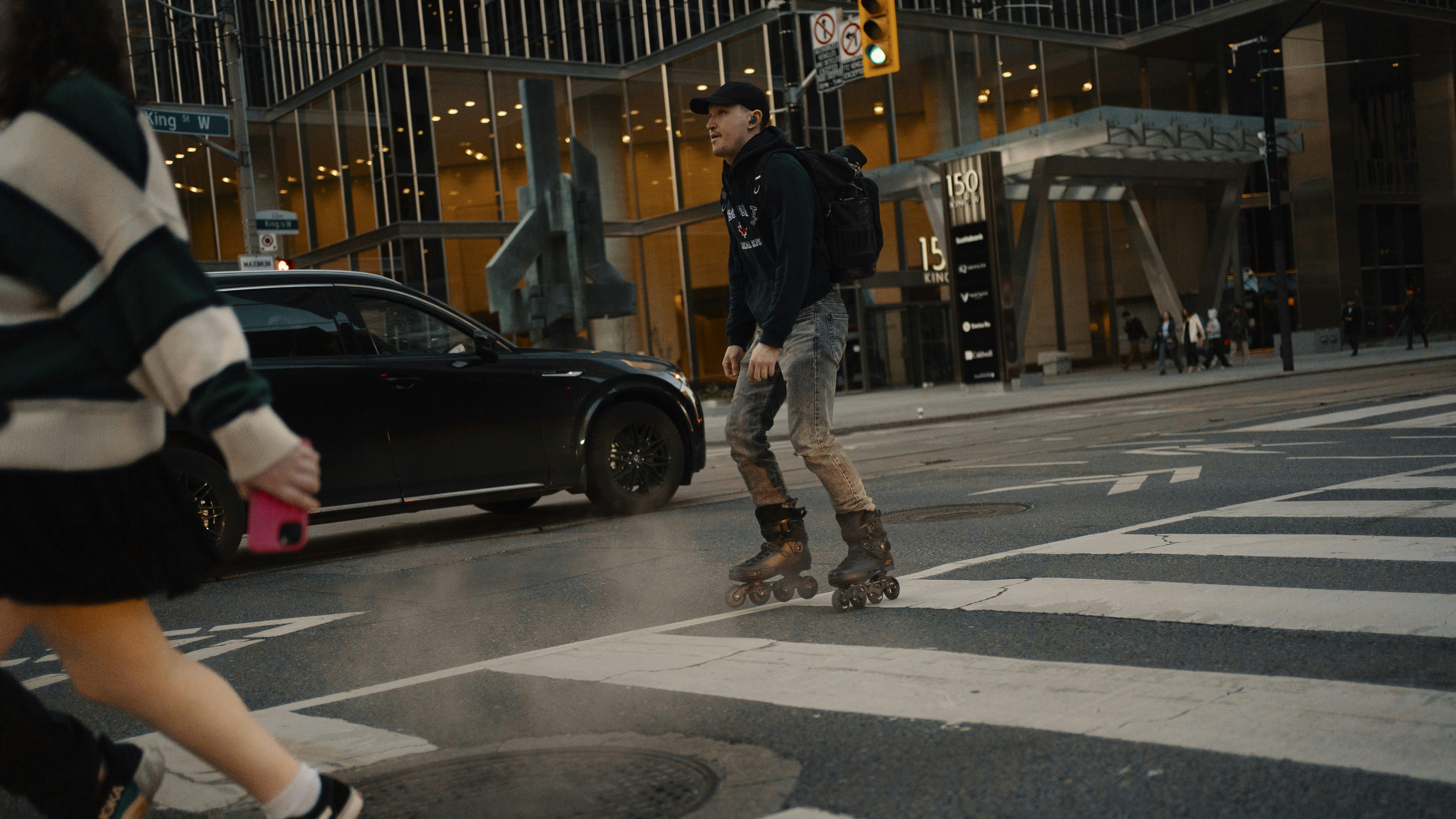 Riding the City Crosswalk: Rollerblades Mid-Stride in a Modern Urban Intersection