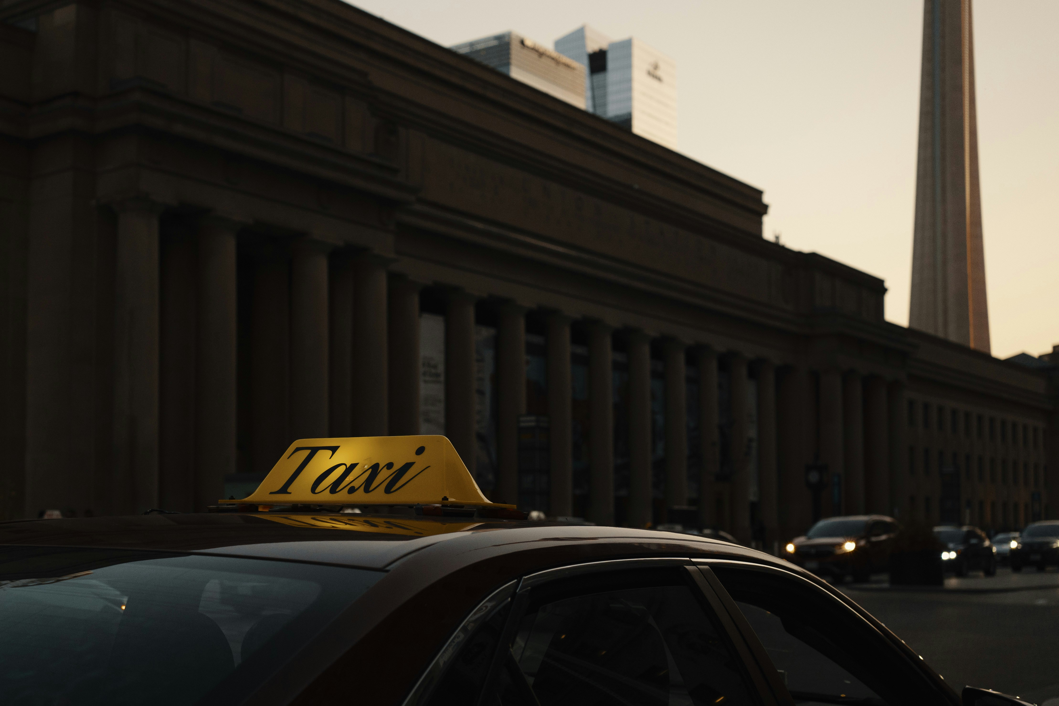 Golden Hour Taxi Silhouette in a Classical Colonnade