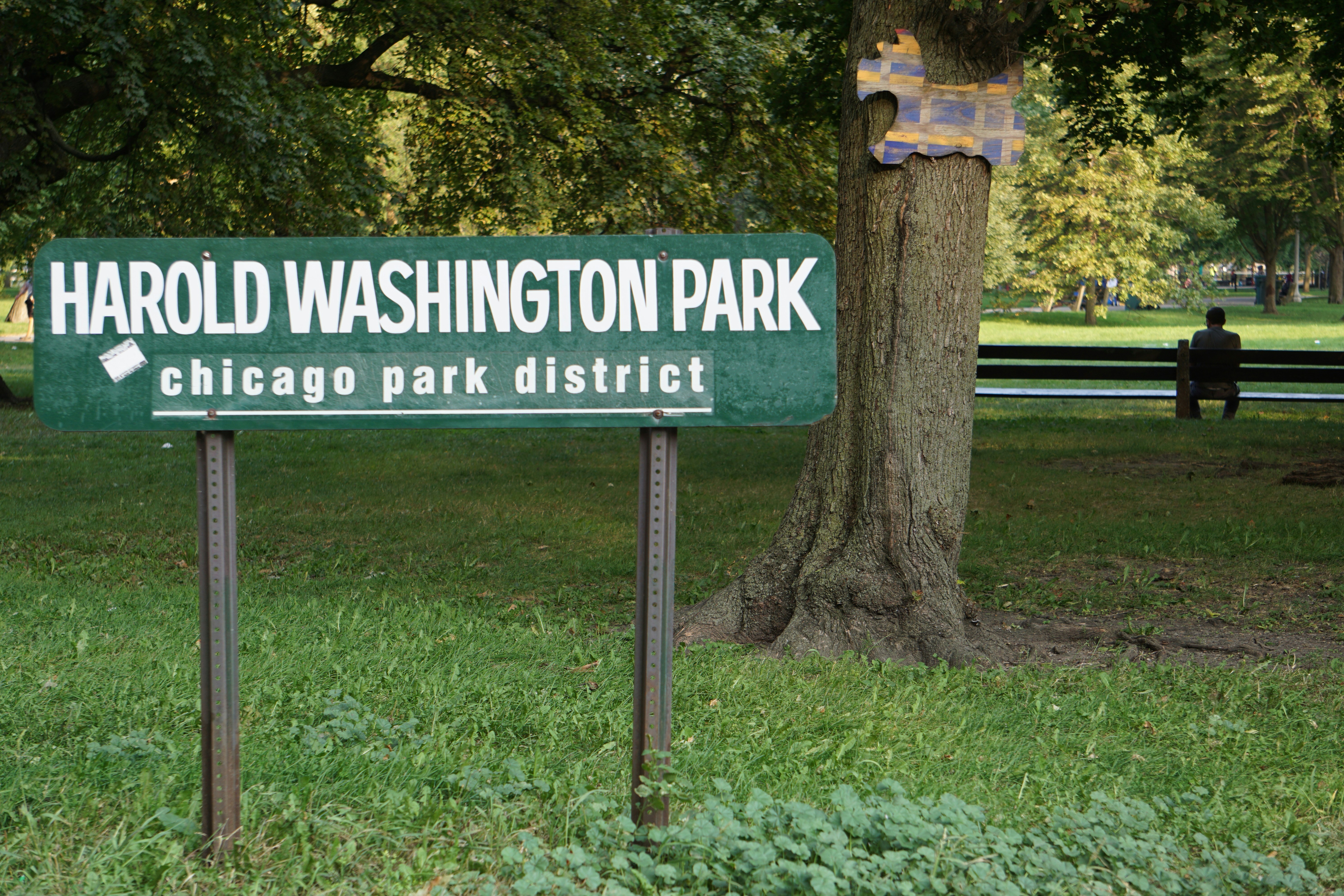 Harold Washington Park Sign Standing Over Lush Chicago Greenery