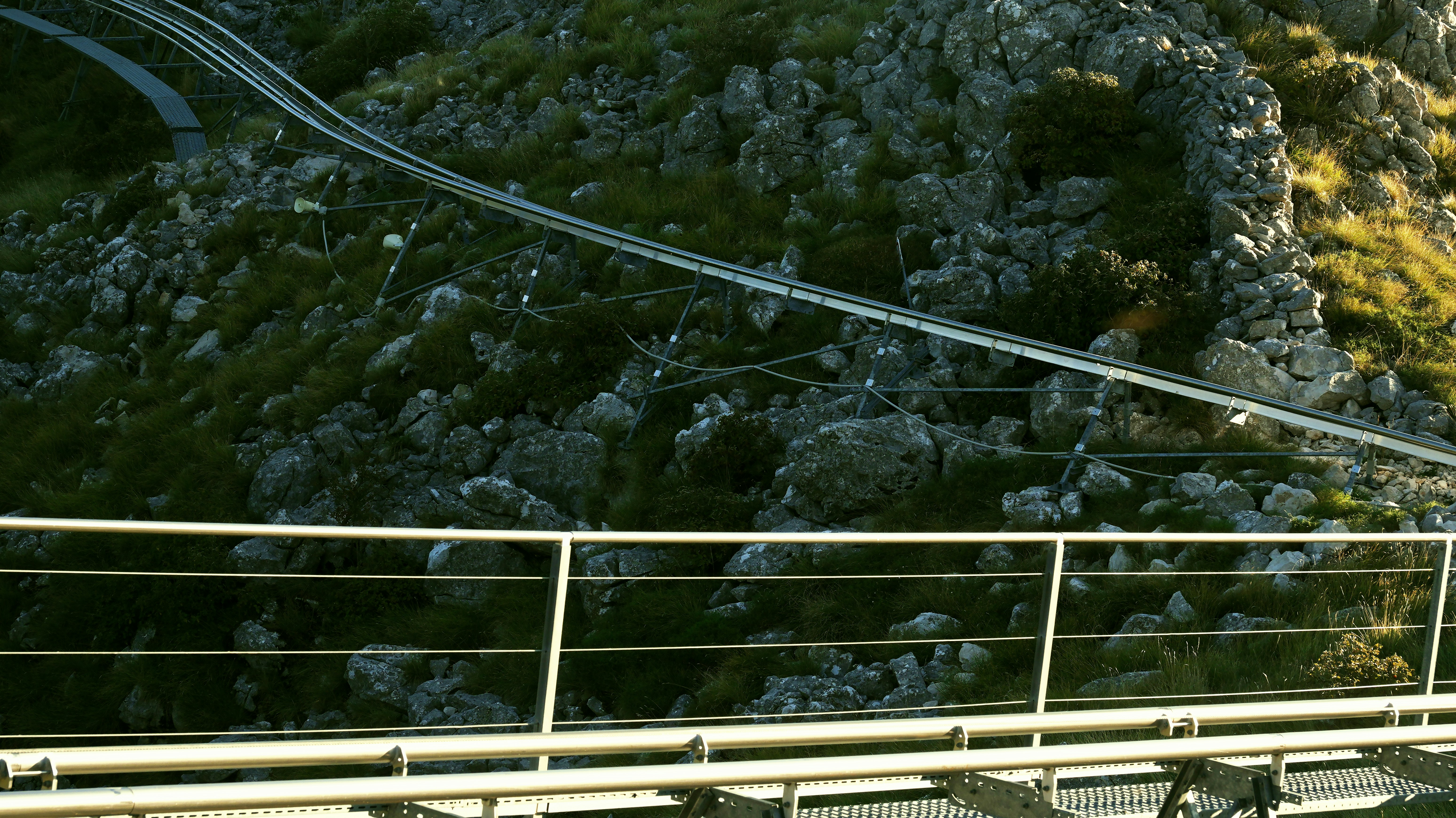 Ridge Crossing: Cable Car Stretches Across a Rocky Vista
