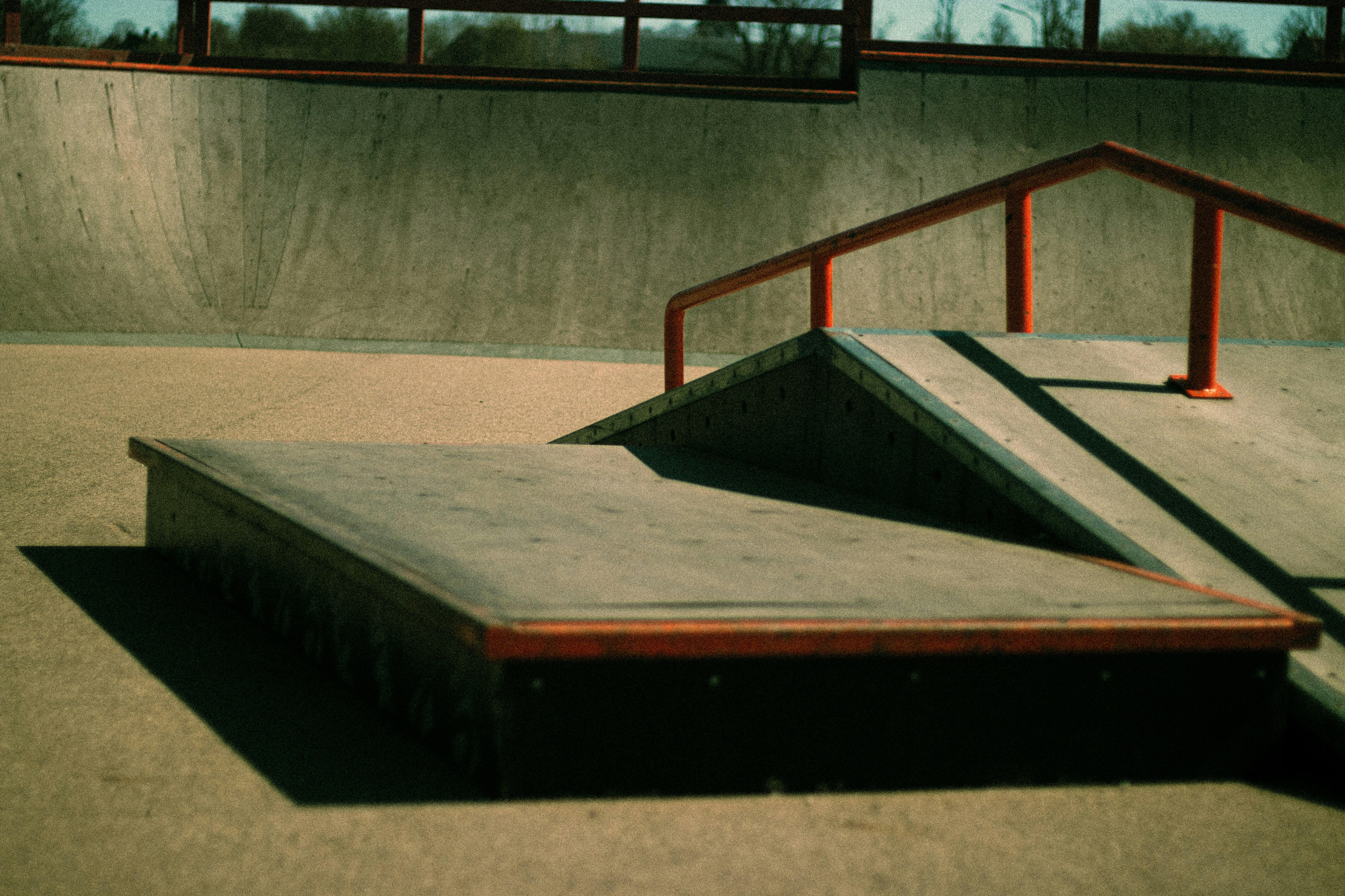 Concrete descent: stairs and shadow carved by rail lines