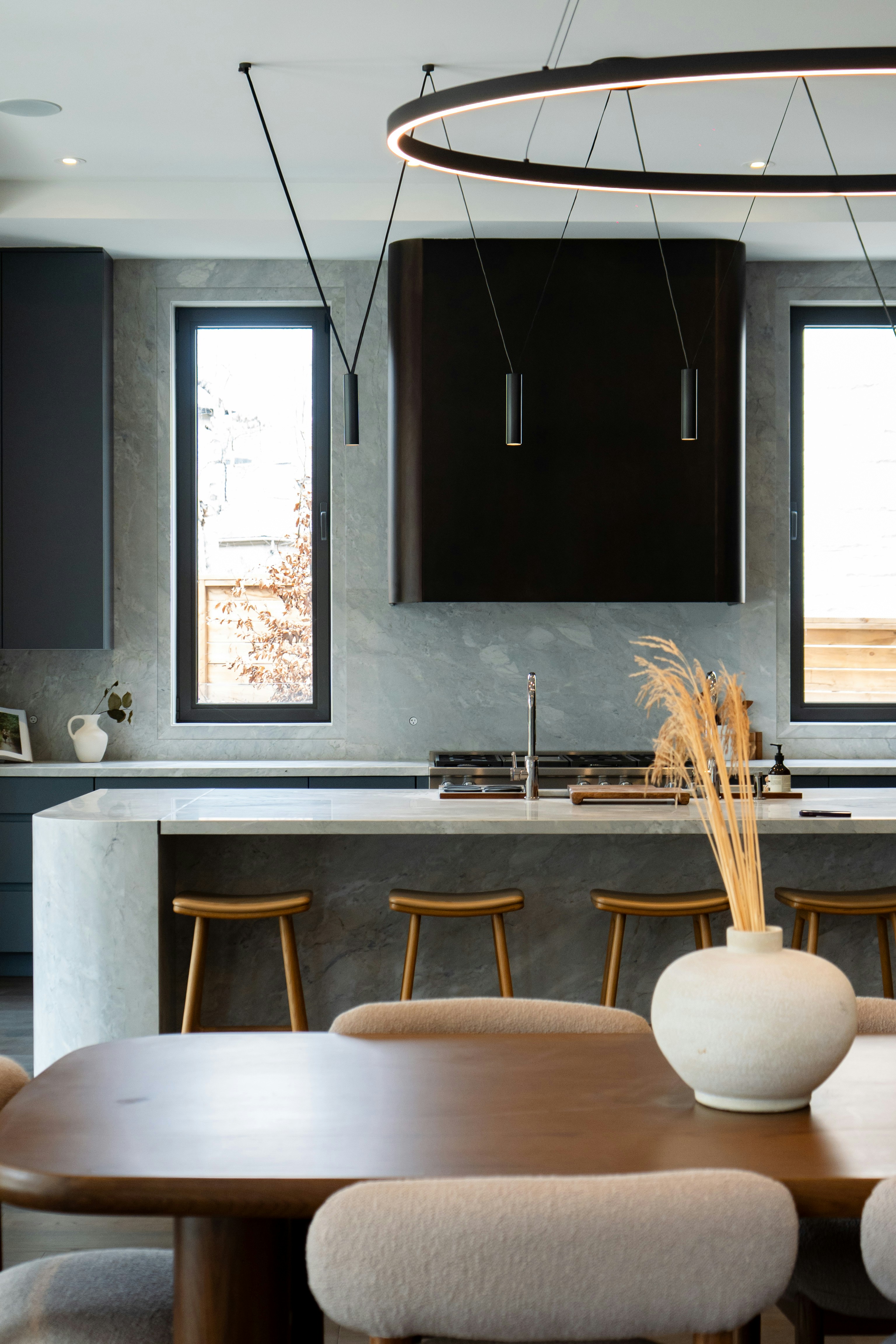 Minimalist Kitchen Island with Pendants and Circular Lighting