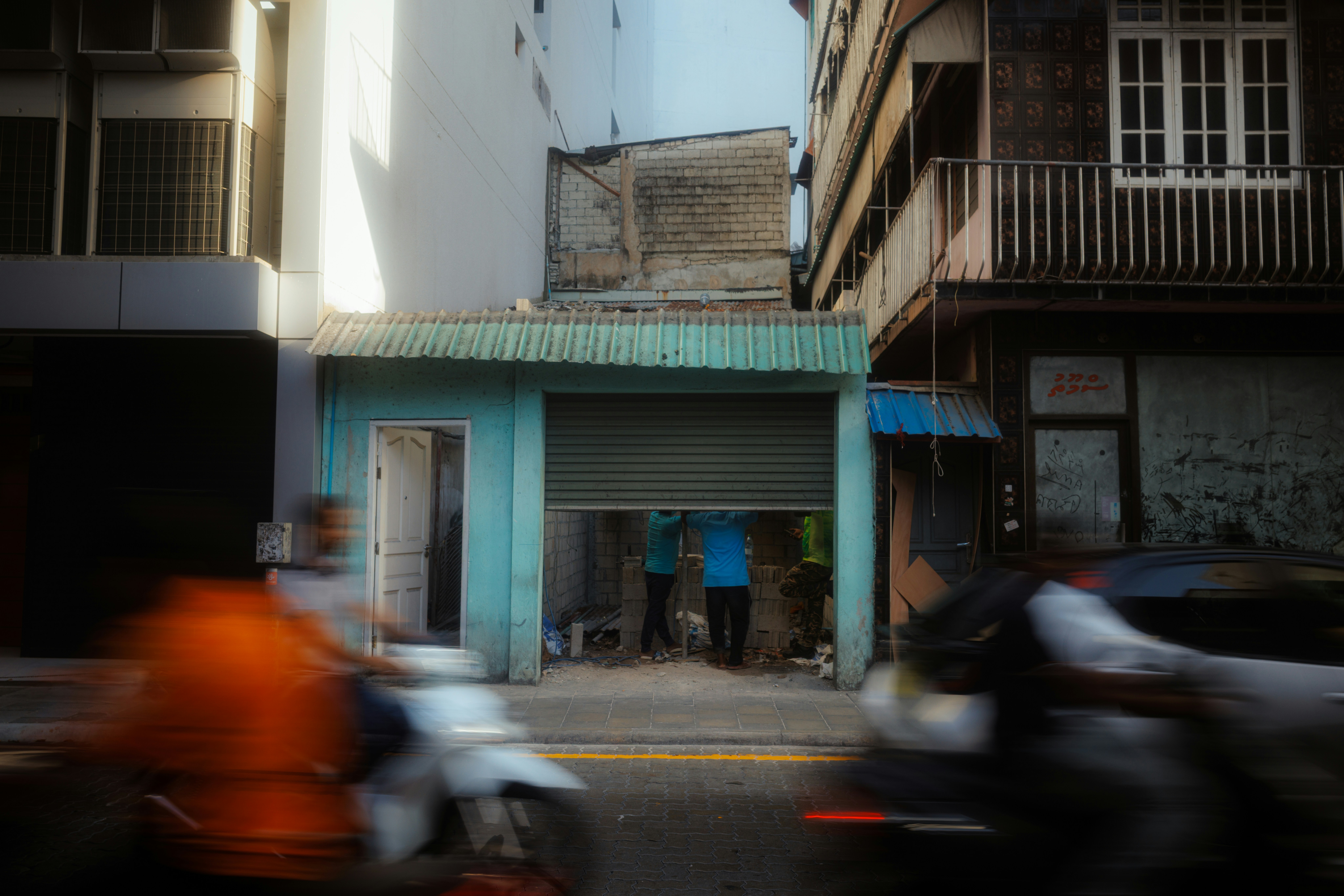 Midtown Shopfront Under Neon Hum