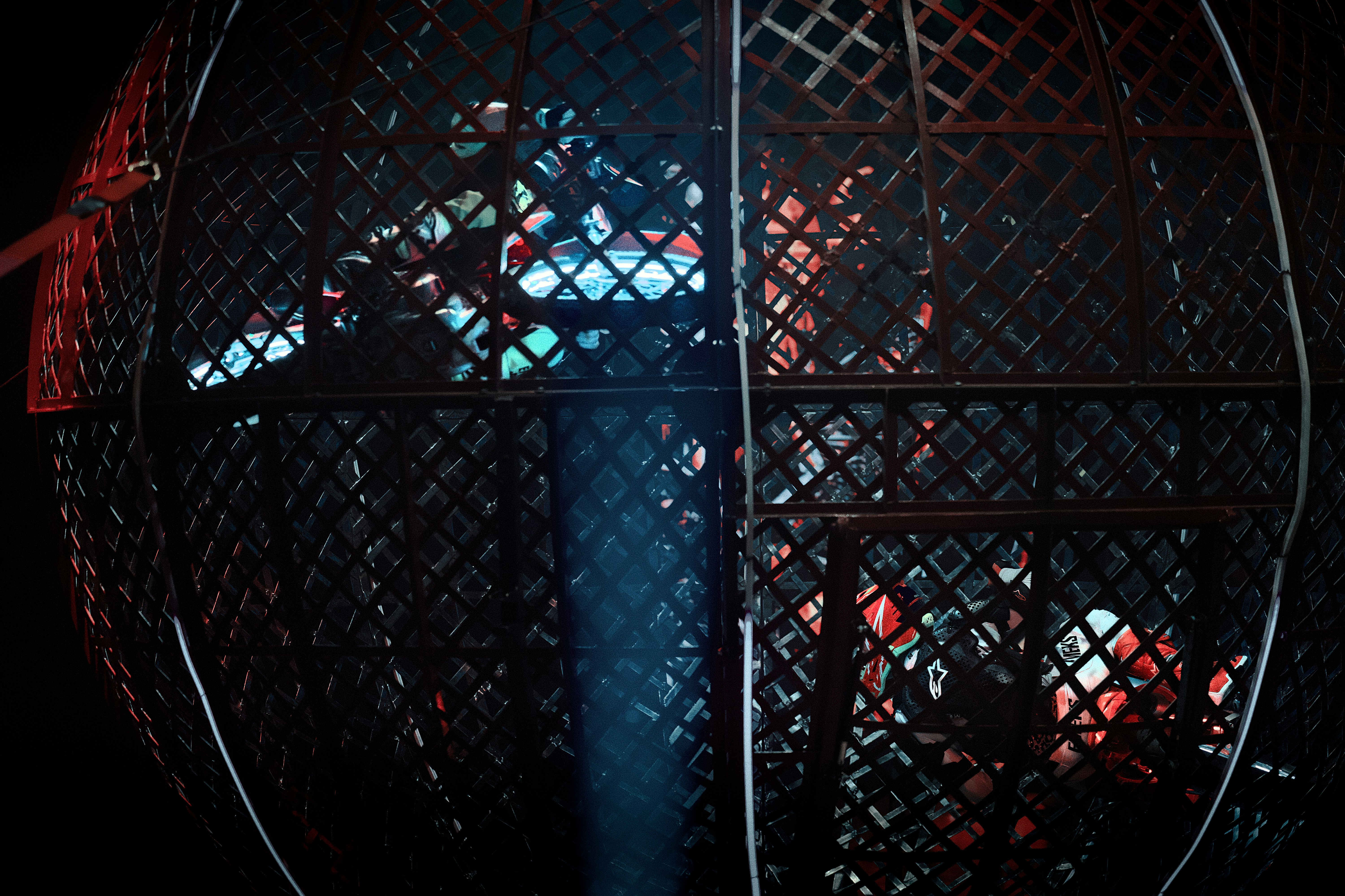 Inside the Cage: Neon Glow and Gridded Grime