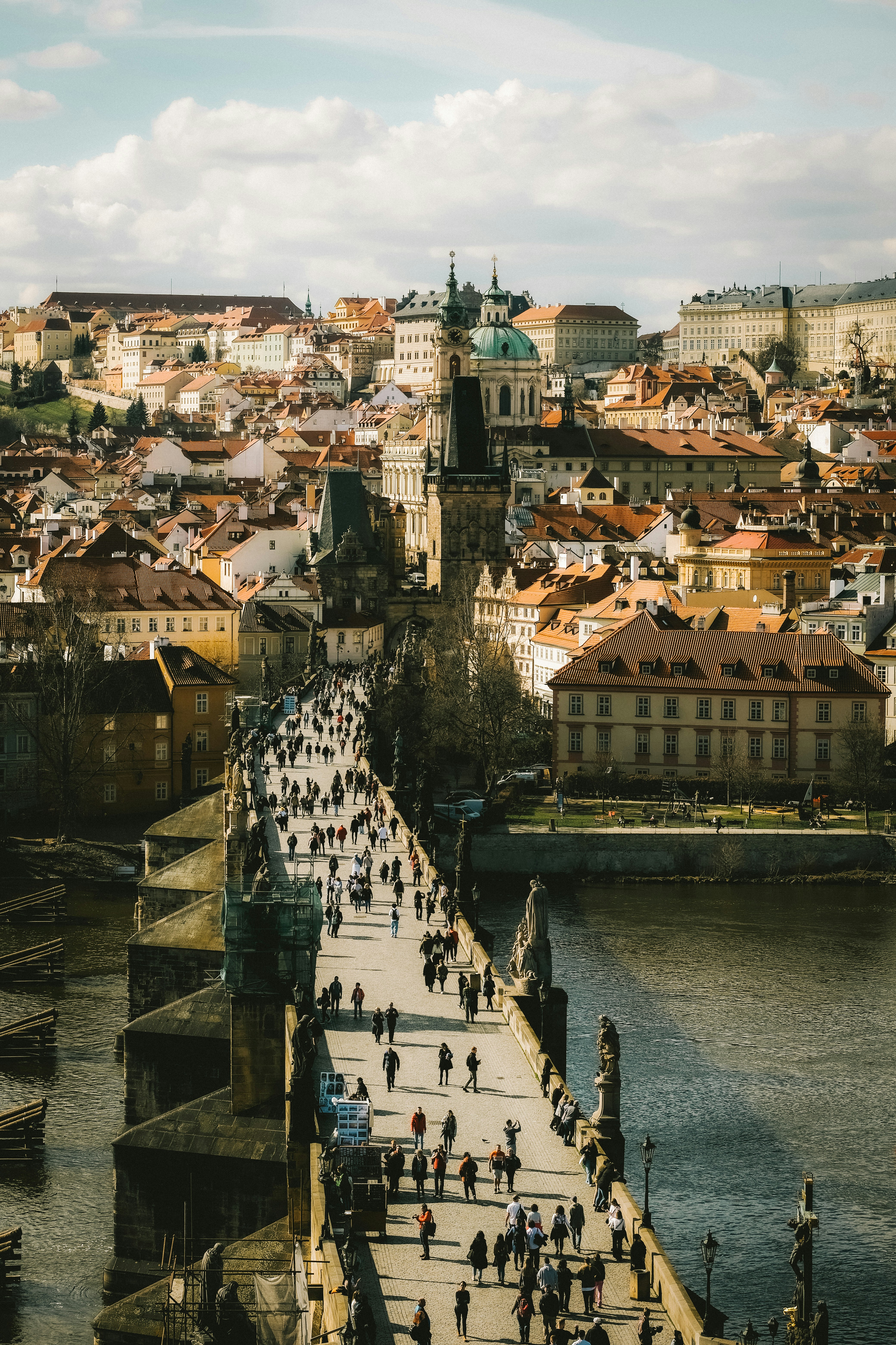 Charles Bridge in Prague: A River of Footsteps Beneath Warm Czech Light