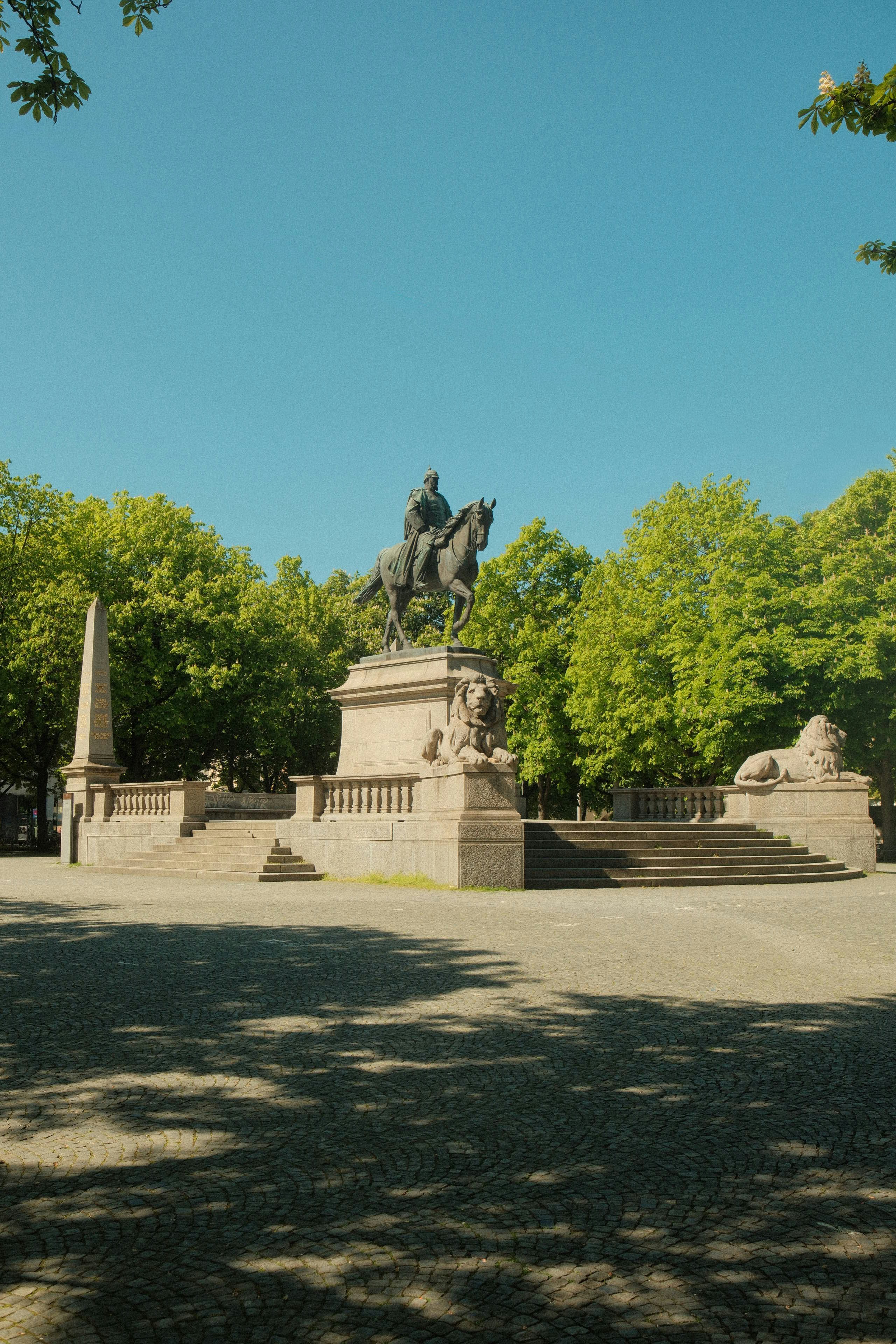 Equestrian Monument Anchored by Lush Green Canopy
