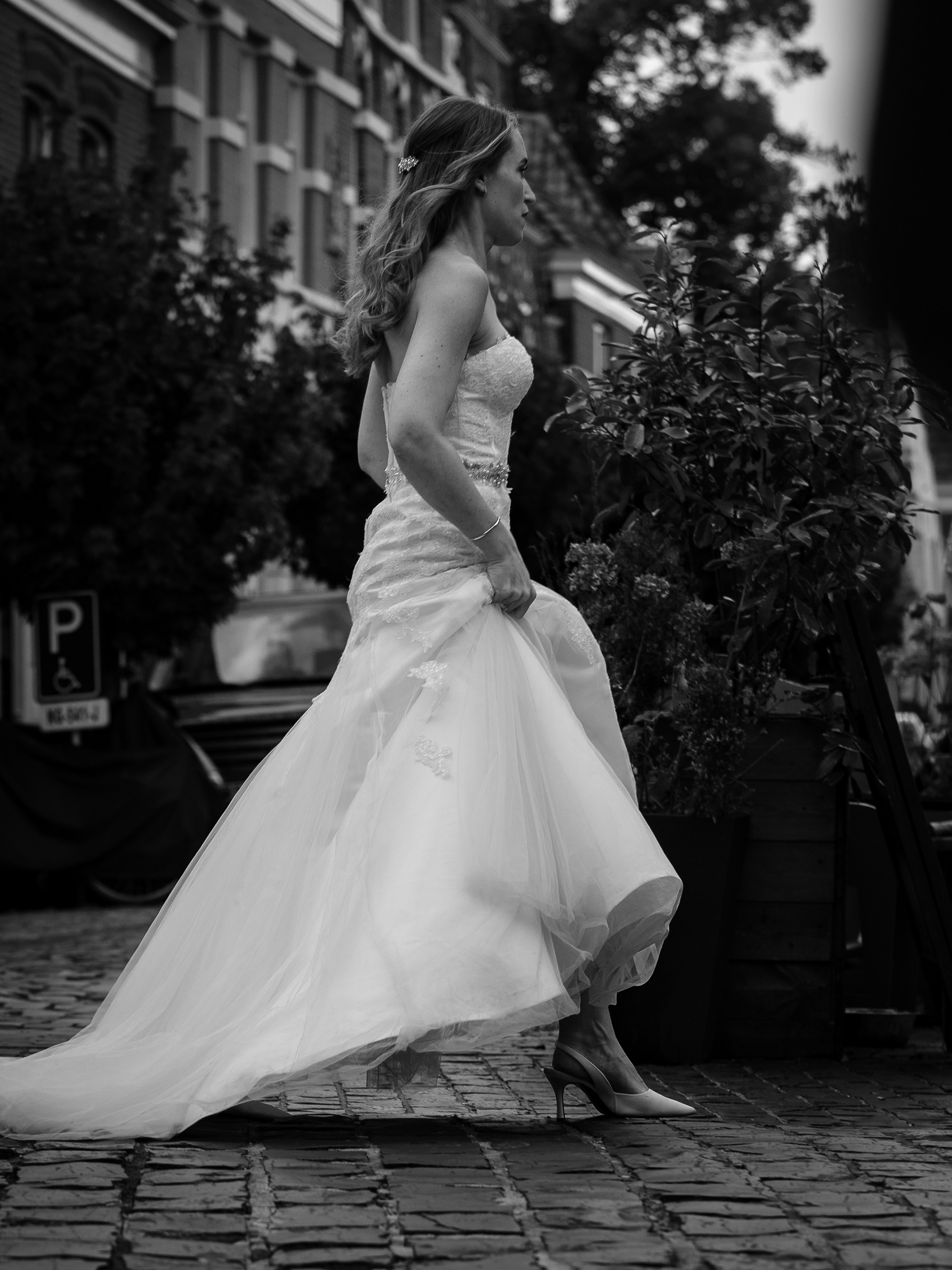 Bride in Motion: A Quiet Stride Through Cobblestones