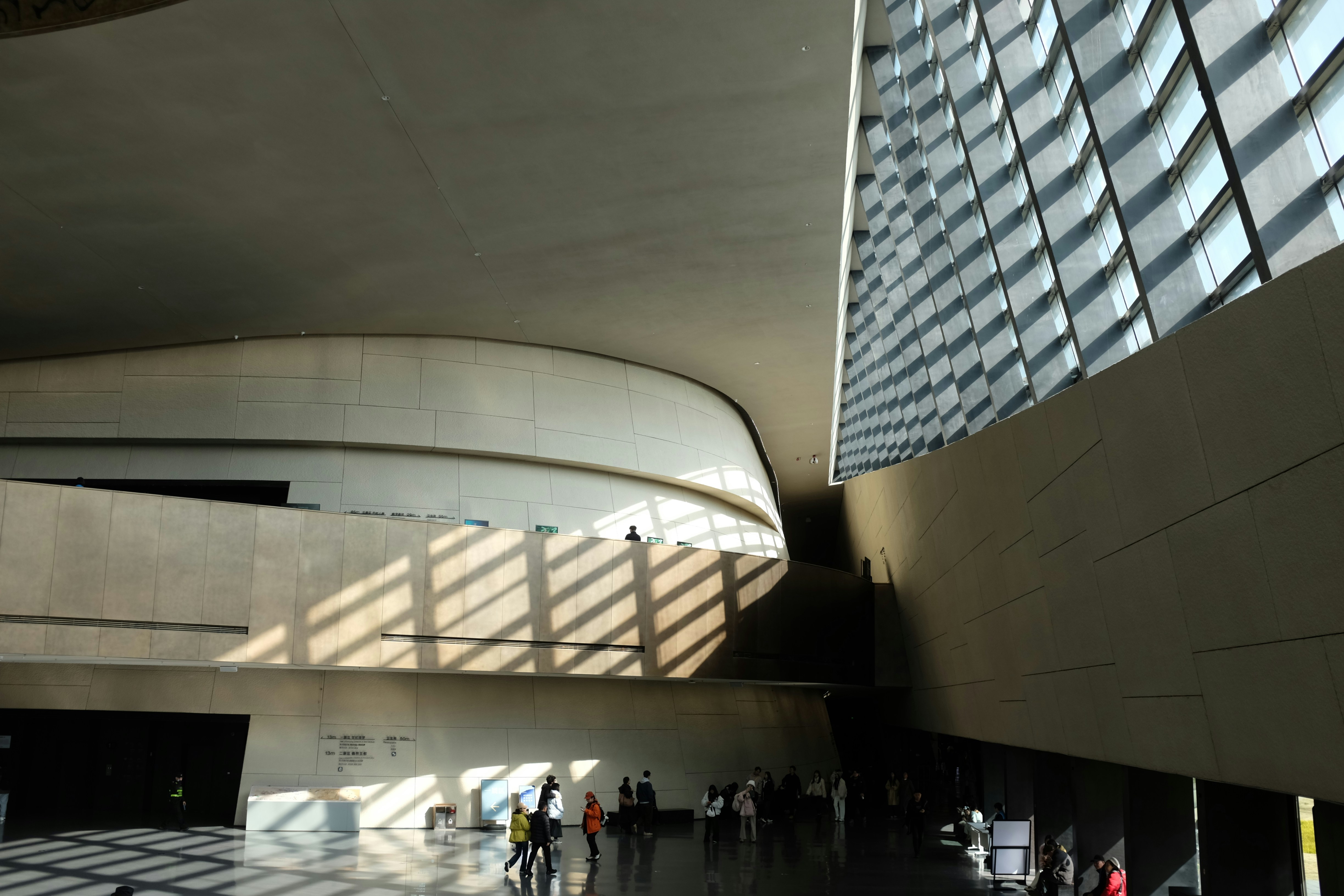 Light and shadow traverse the modern atrium