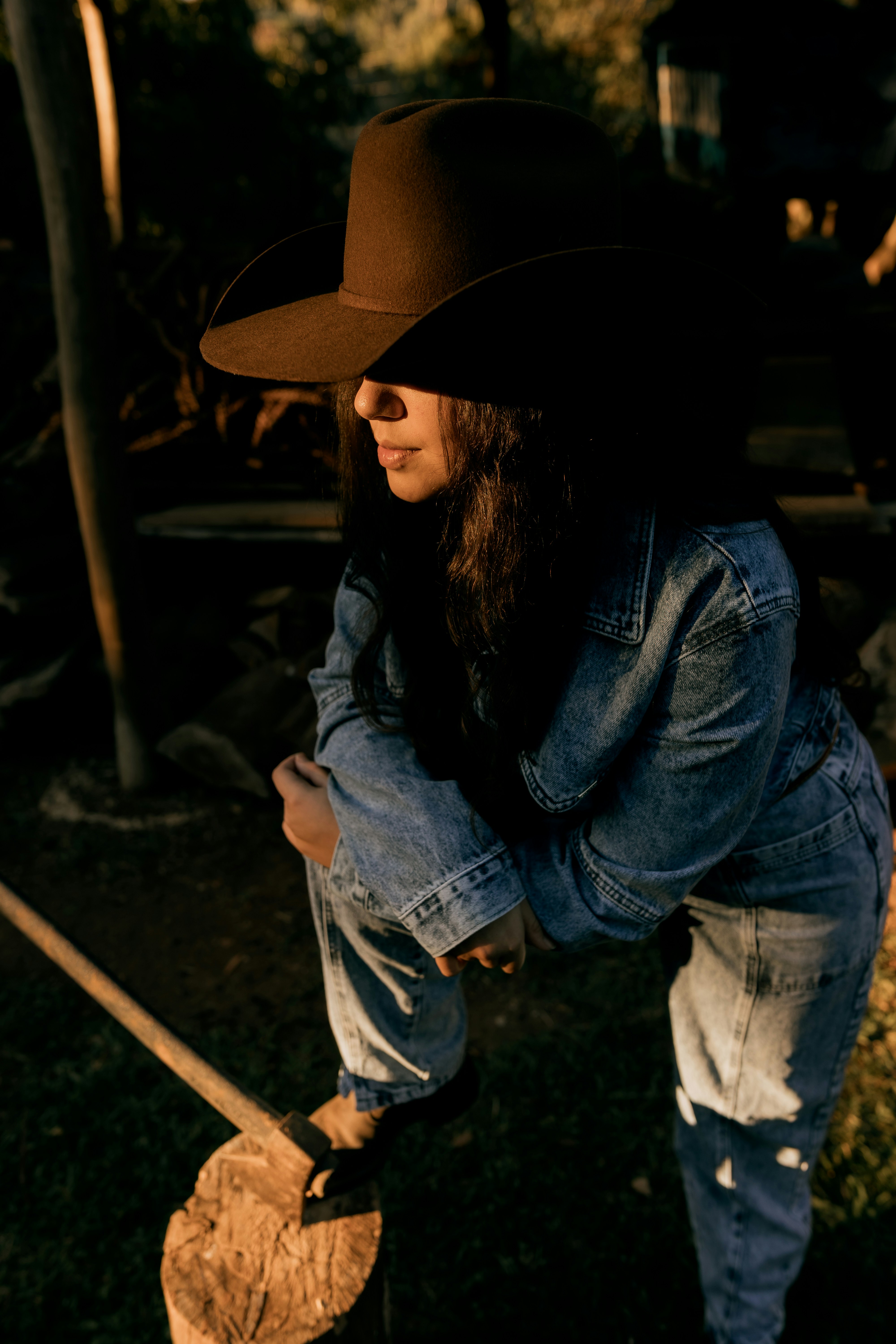 Shadowed Profile Under Wide-Brim: A Quiet Moment in Denim