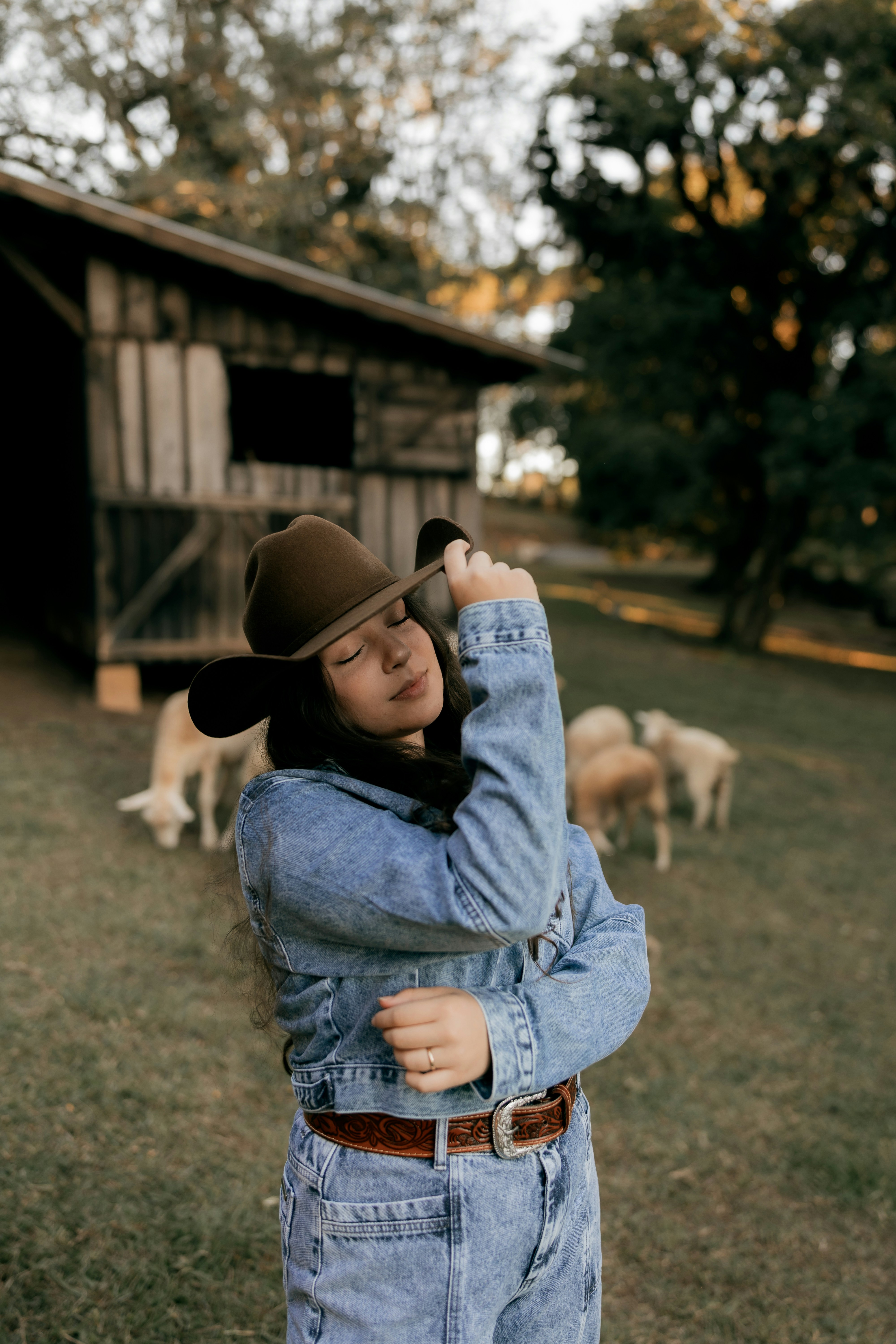 Paisley in the Farmyard: A Quiet Moment with a Cowboy Hat