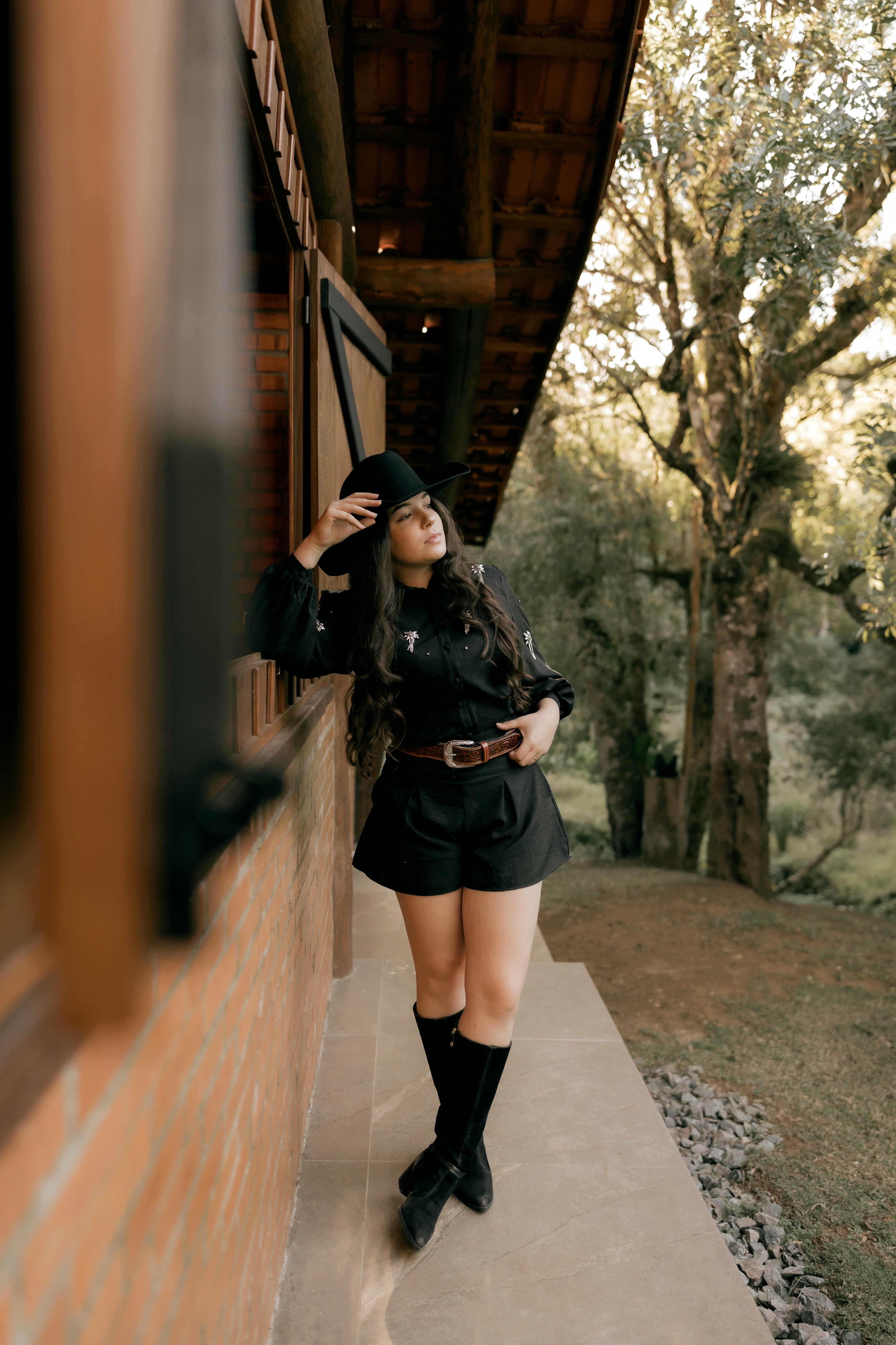 Cowboy Hat Echoes: A Quiet Portrait on the Porch