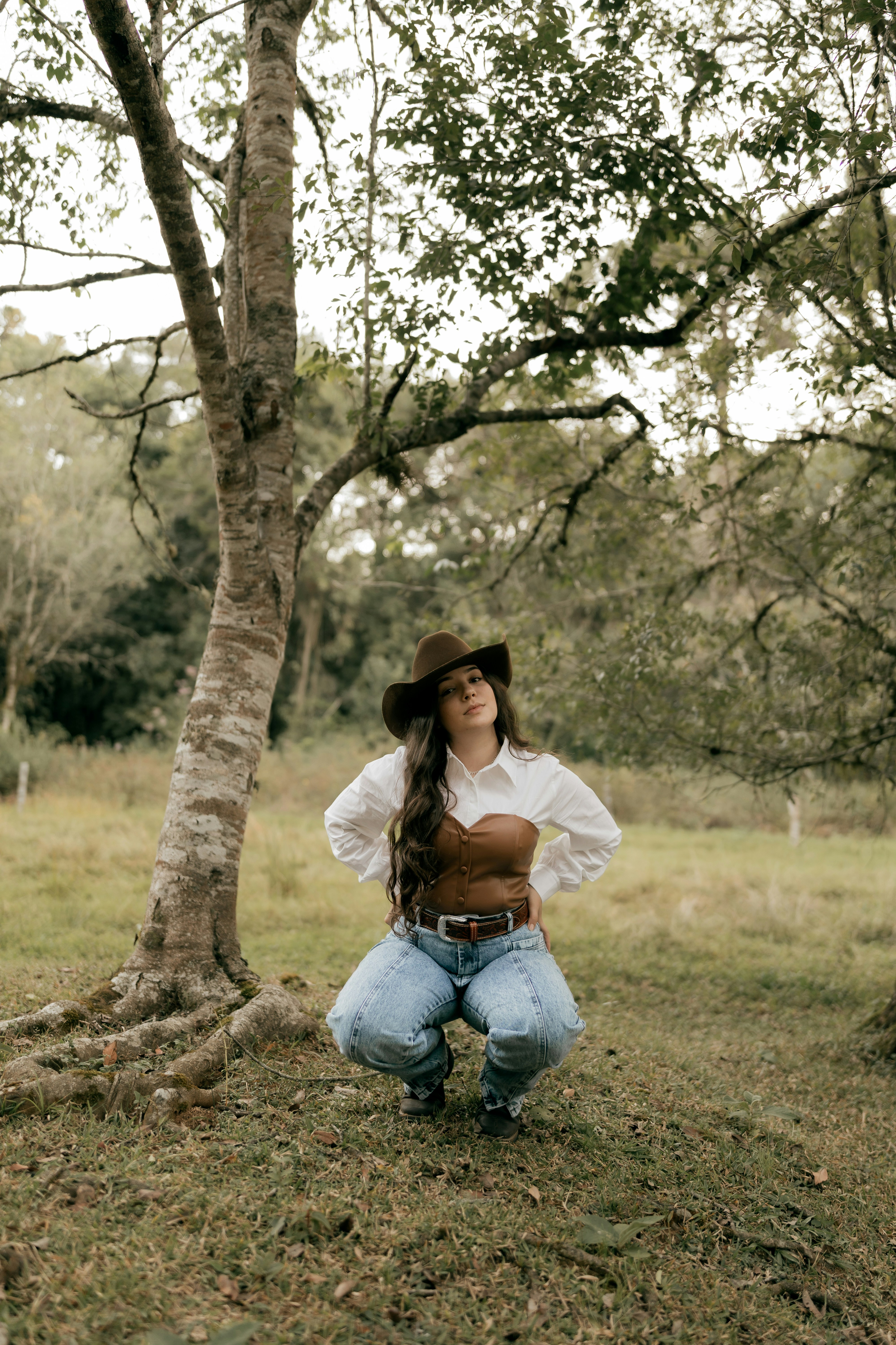 Cowgirl in a Sunlit Clearing
