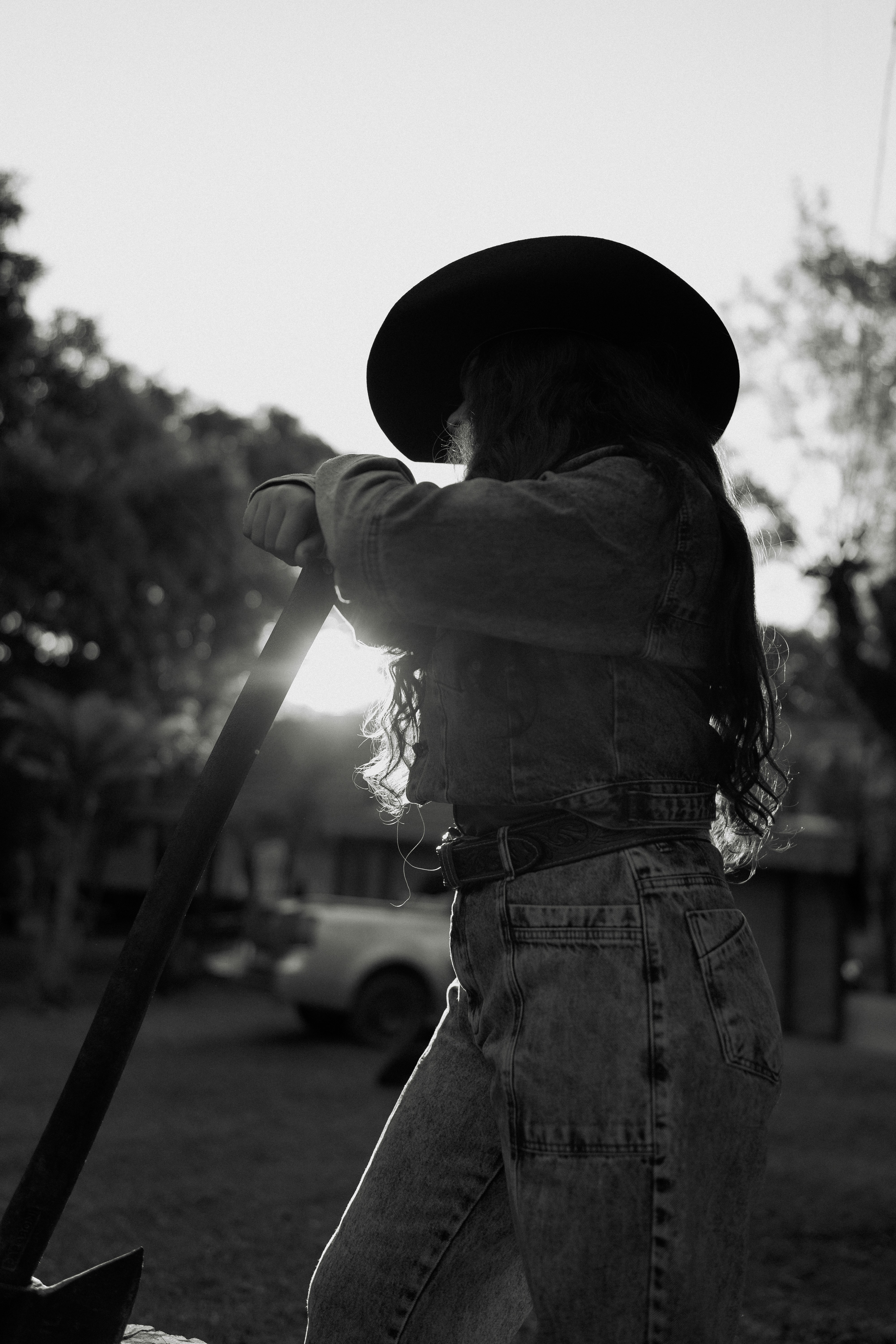 Shadows and Shield: A Lone Rider at Dusk