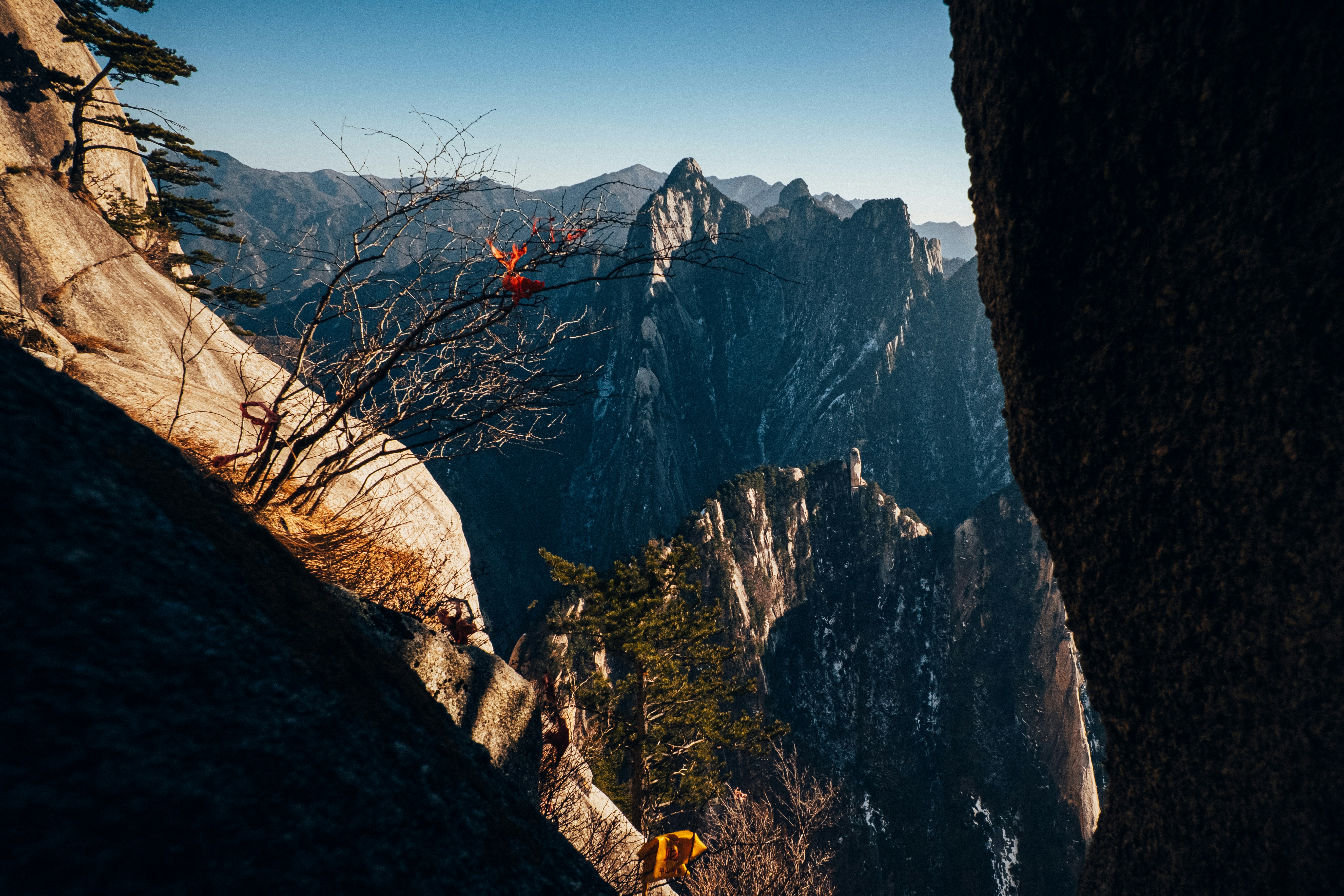 Edge of the Canyon: A Climbers’ Silhouette Amid Granite Giants