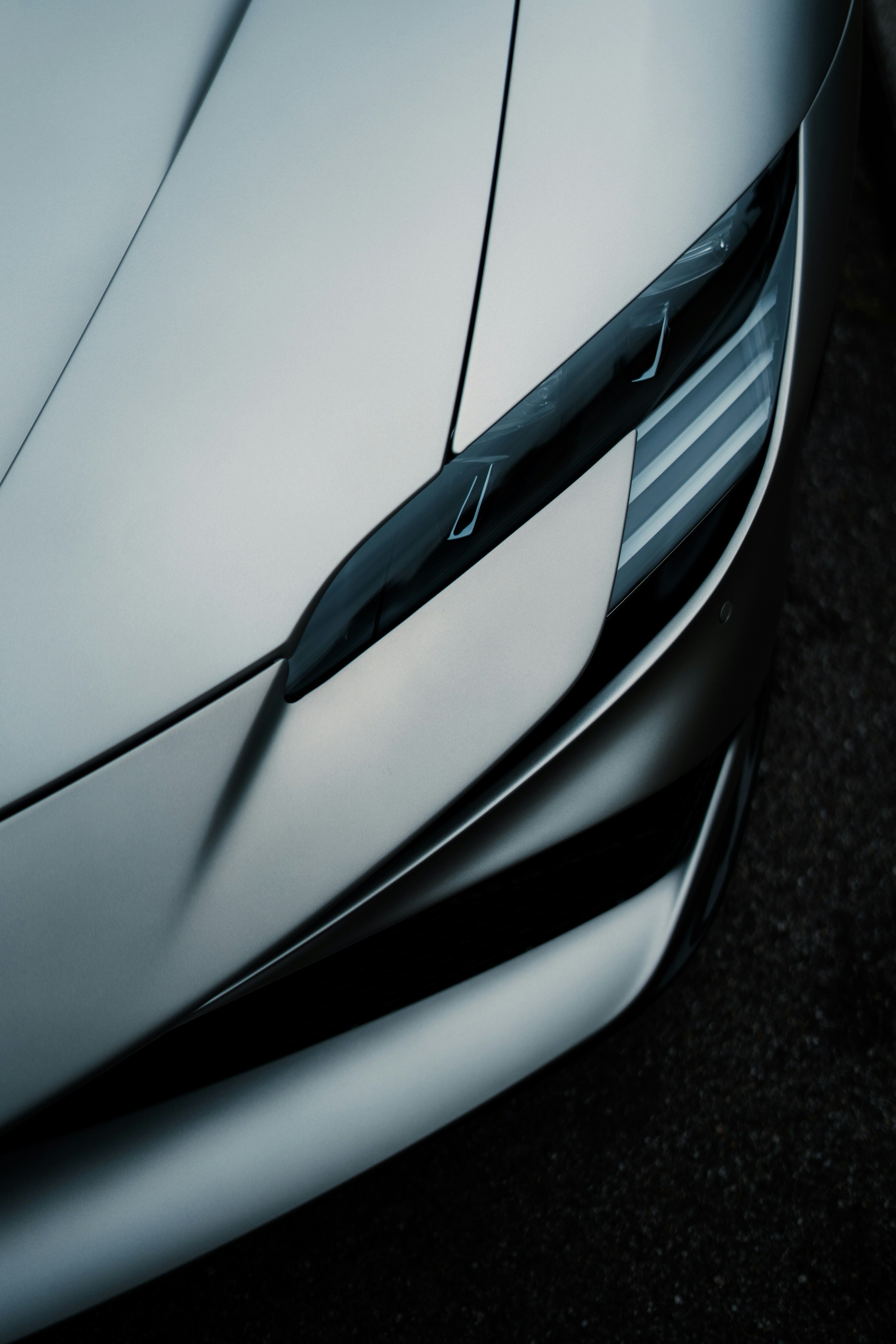 Sleek Curves at Dusk: The Front Profile of a Silver Machine