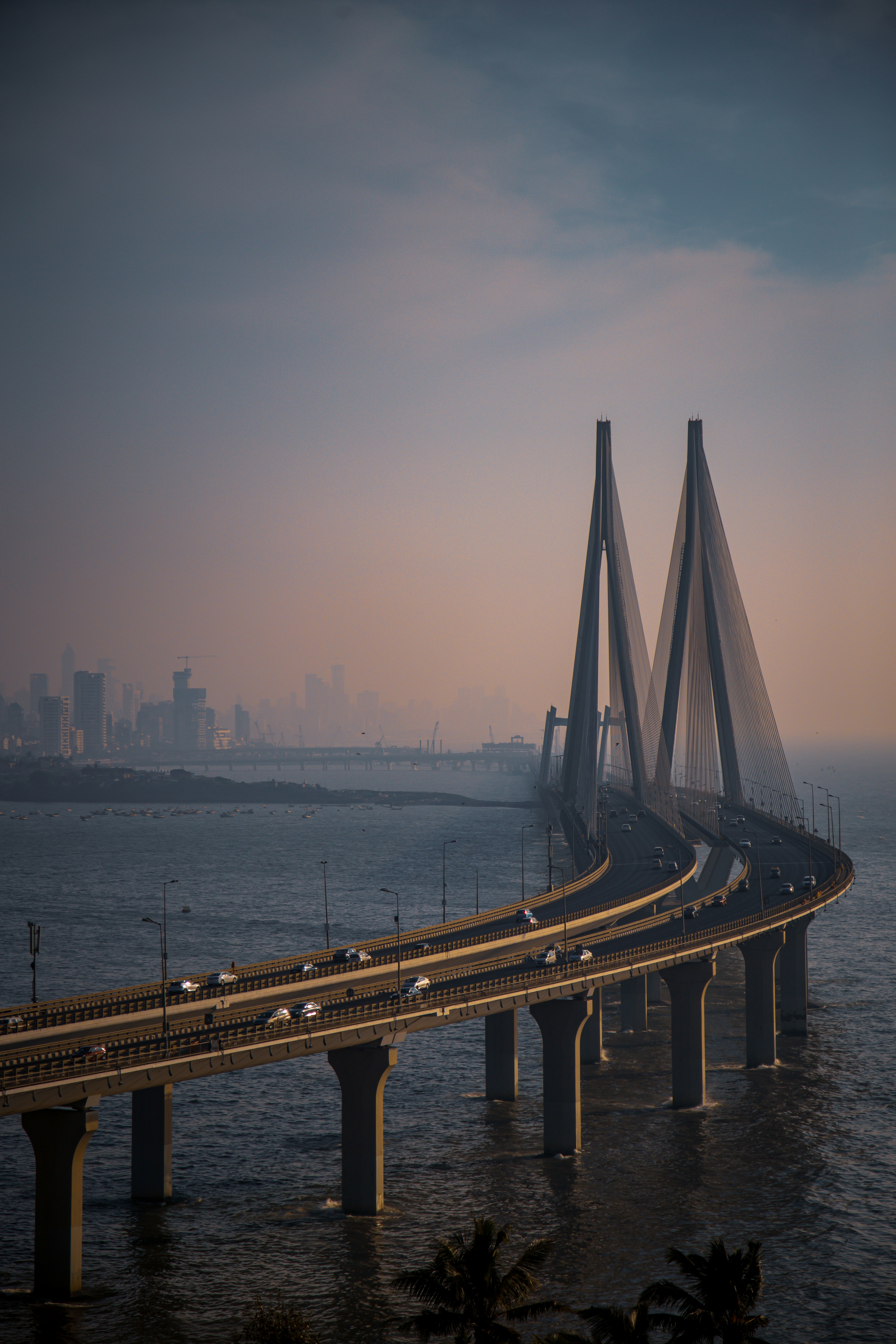 Suspended Spires Over the River: A Piercing View of a Cable-Bridge at Dusk