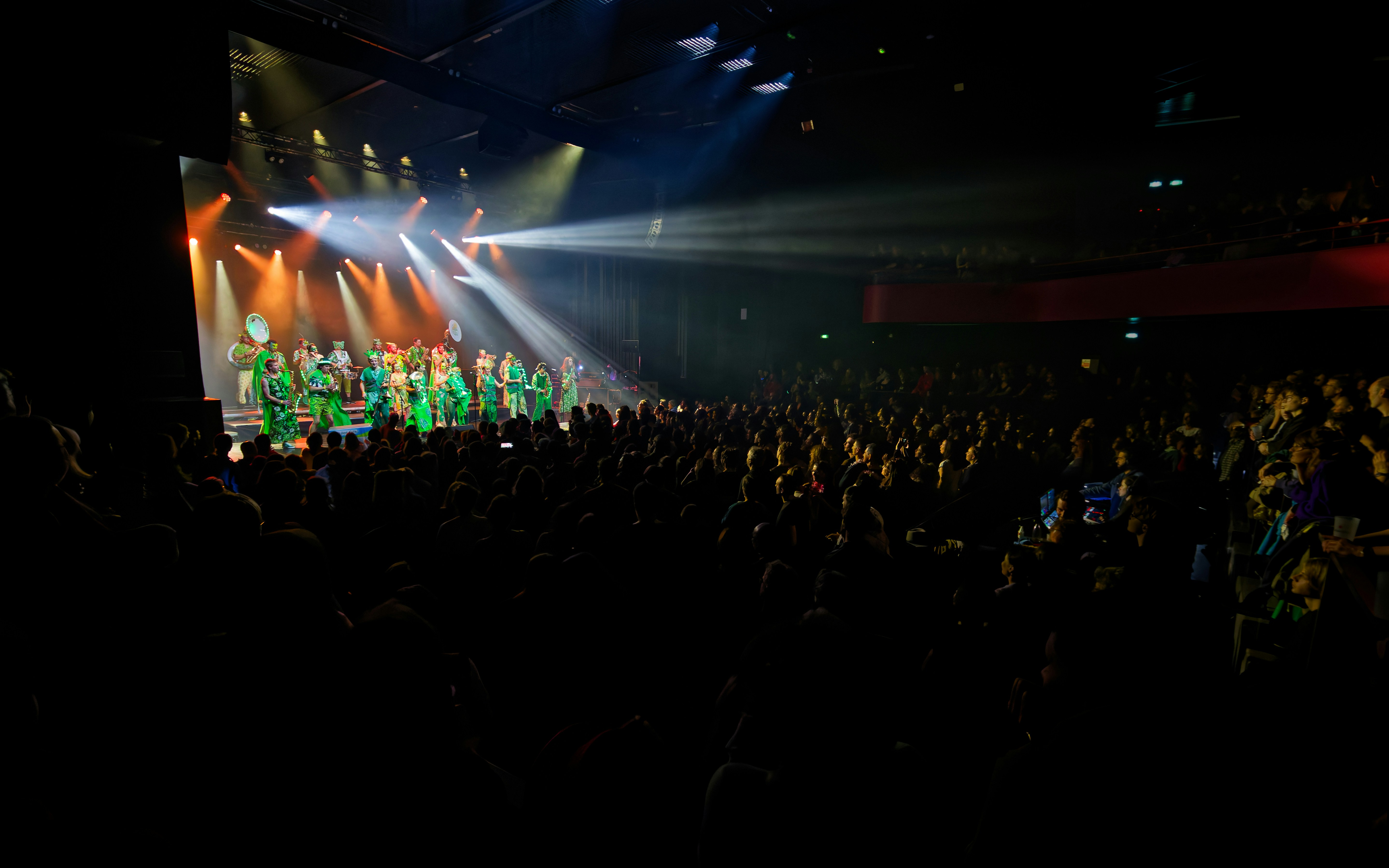 Green Wave on Stage: A Choir Under Stage Lights