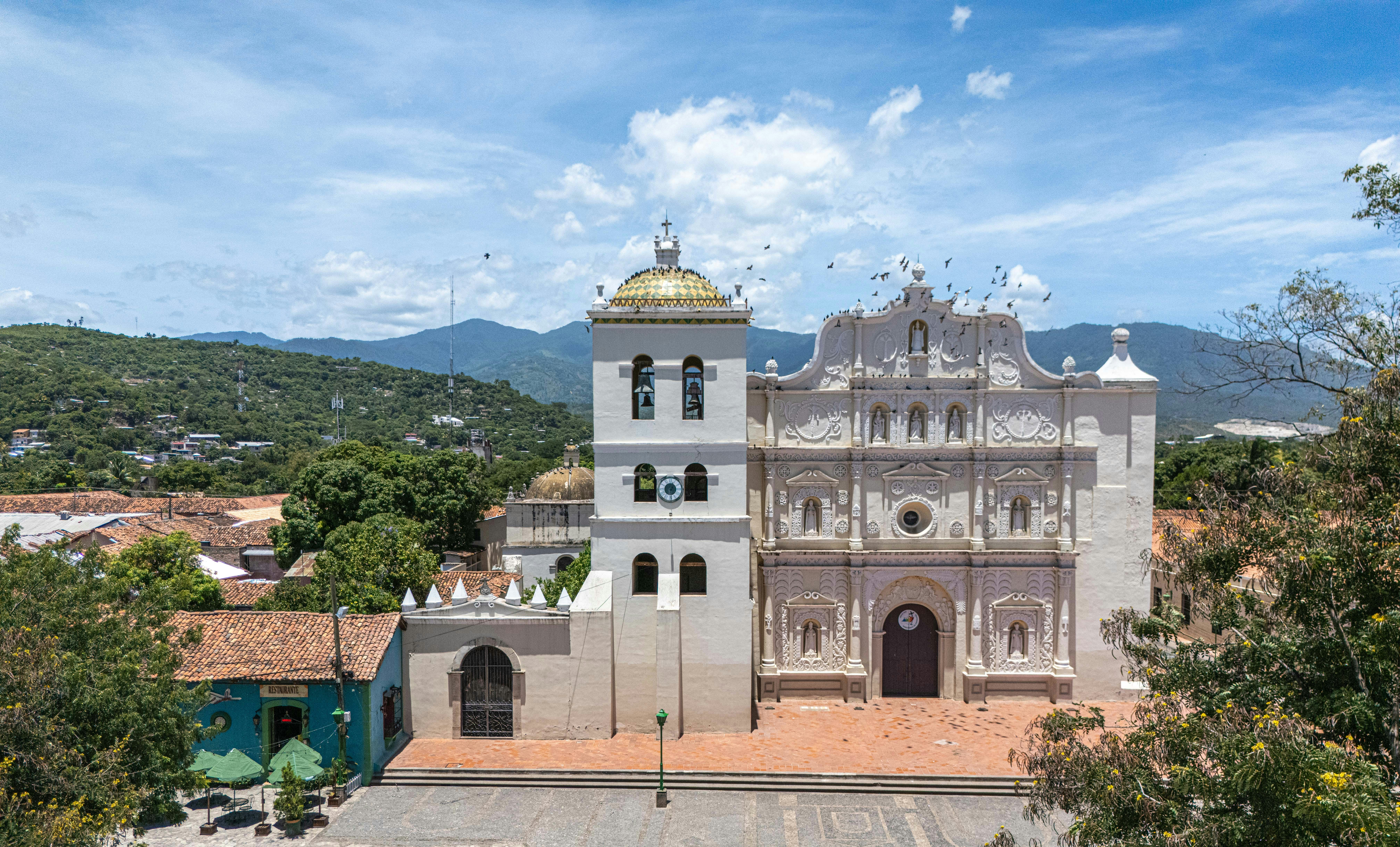 White Baroque Facade Overlooking A Quiet Plaza